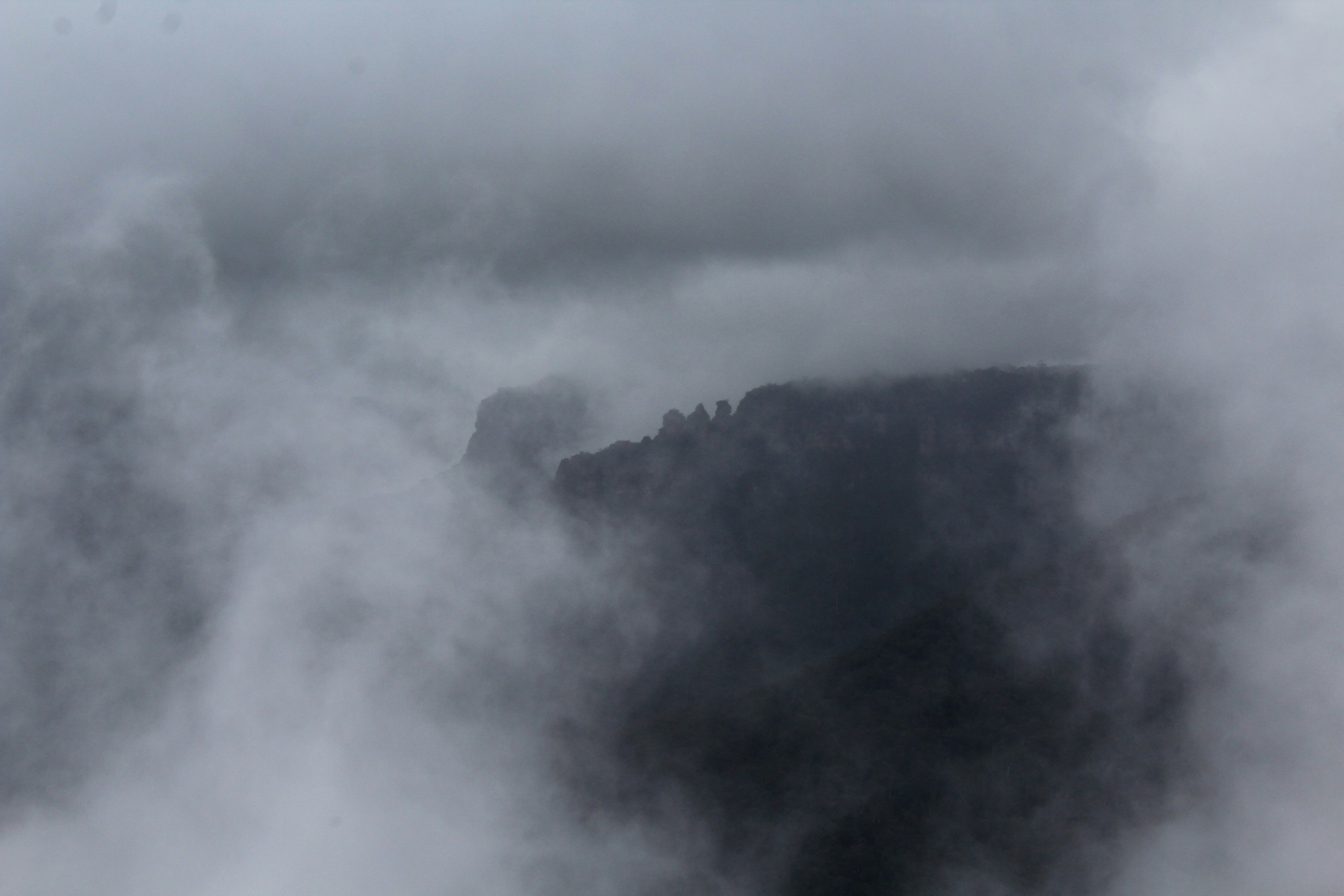 Fog-Clad Cliff Edge in Quiet Descent