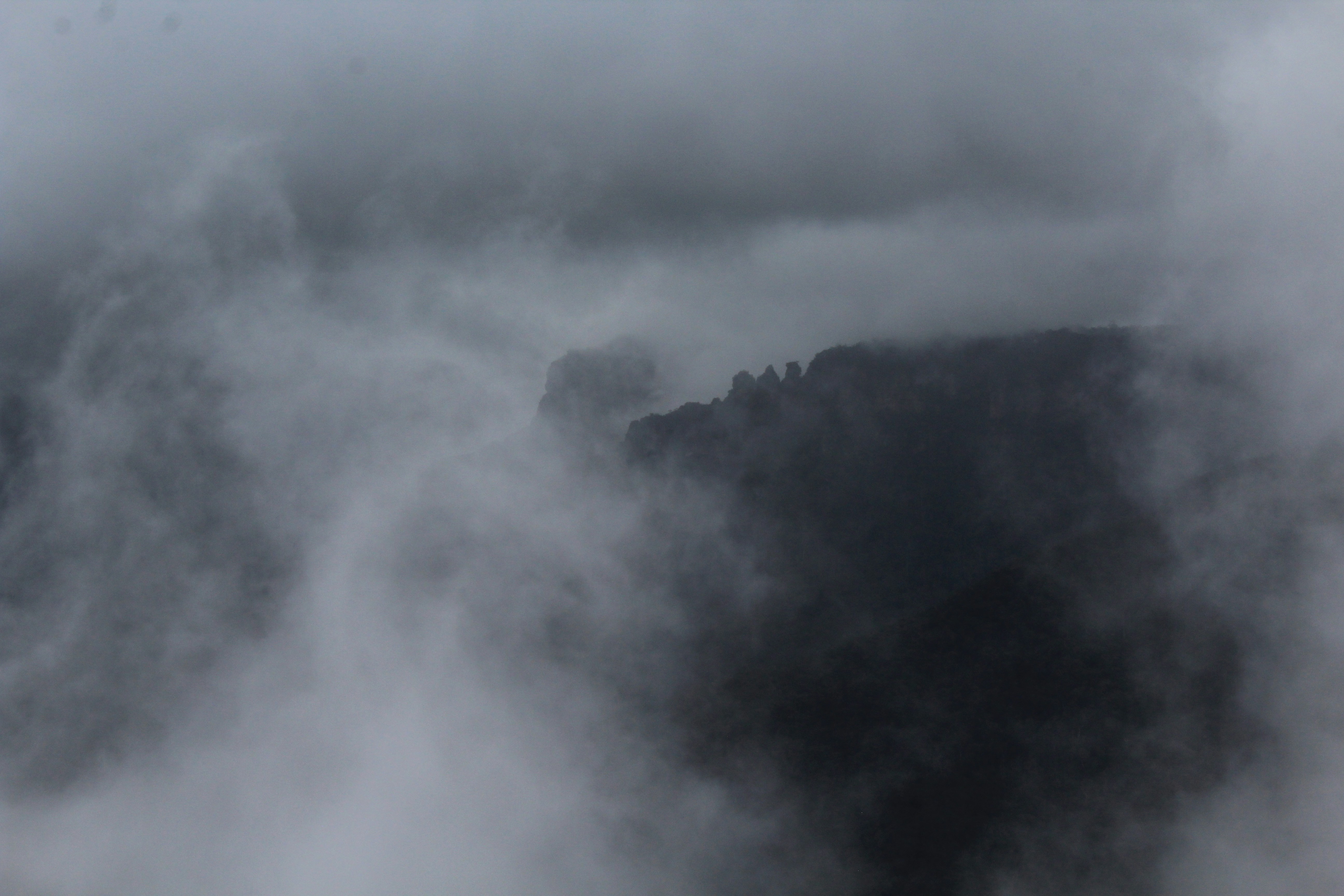 Fog-Crowned Cliff: A Quiet Veil Over the Gorge