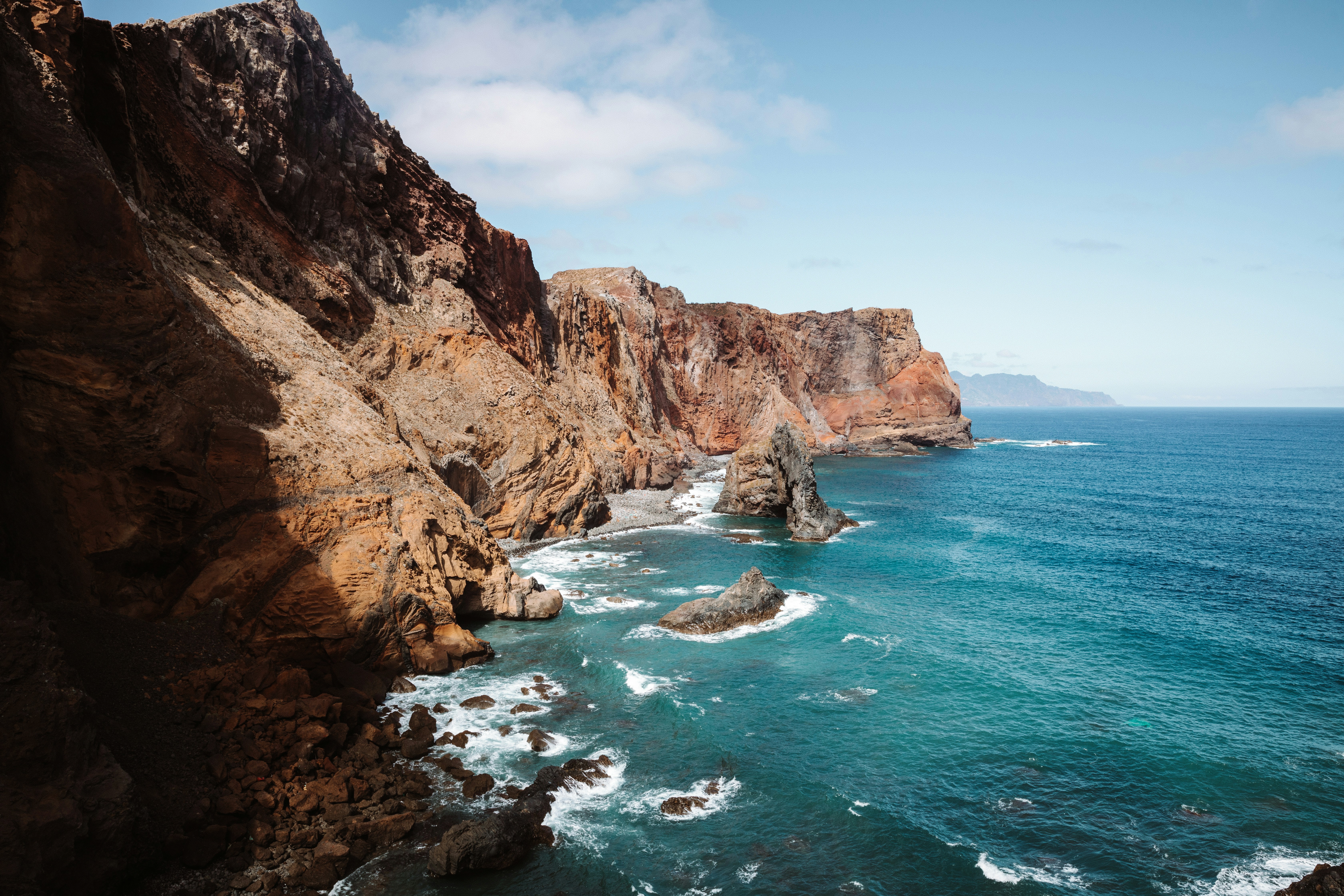 Cobalt Coastline: Rugged Cliffs Meet Turquoise Seas