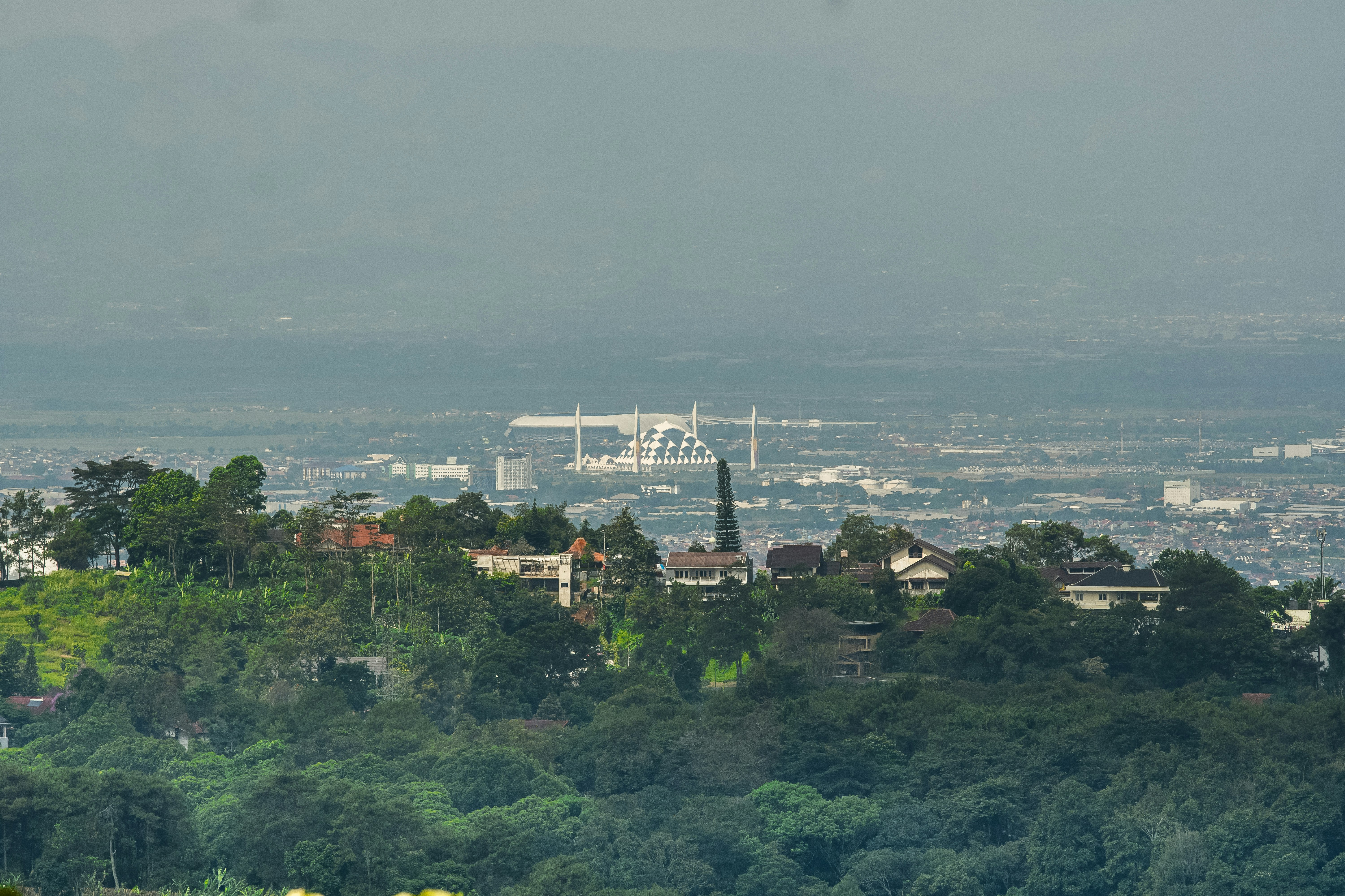 Hilltop Settlement Lookout Beneath a Distant Stadium