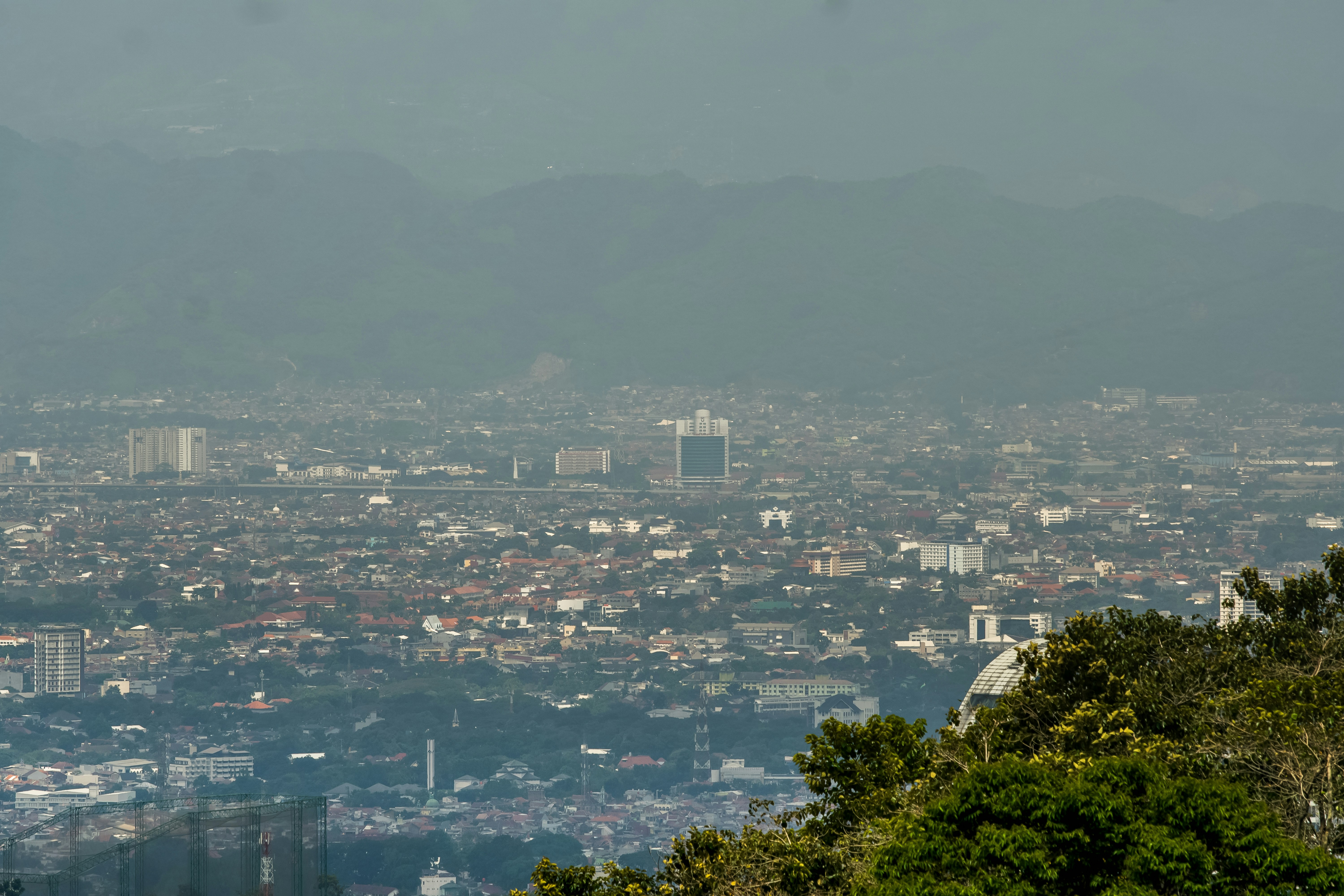 Urban Valley: Distant Skyline Framed by Hills