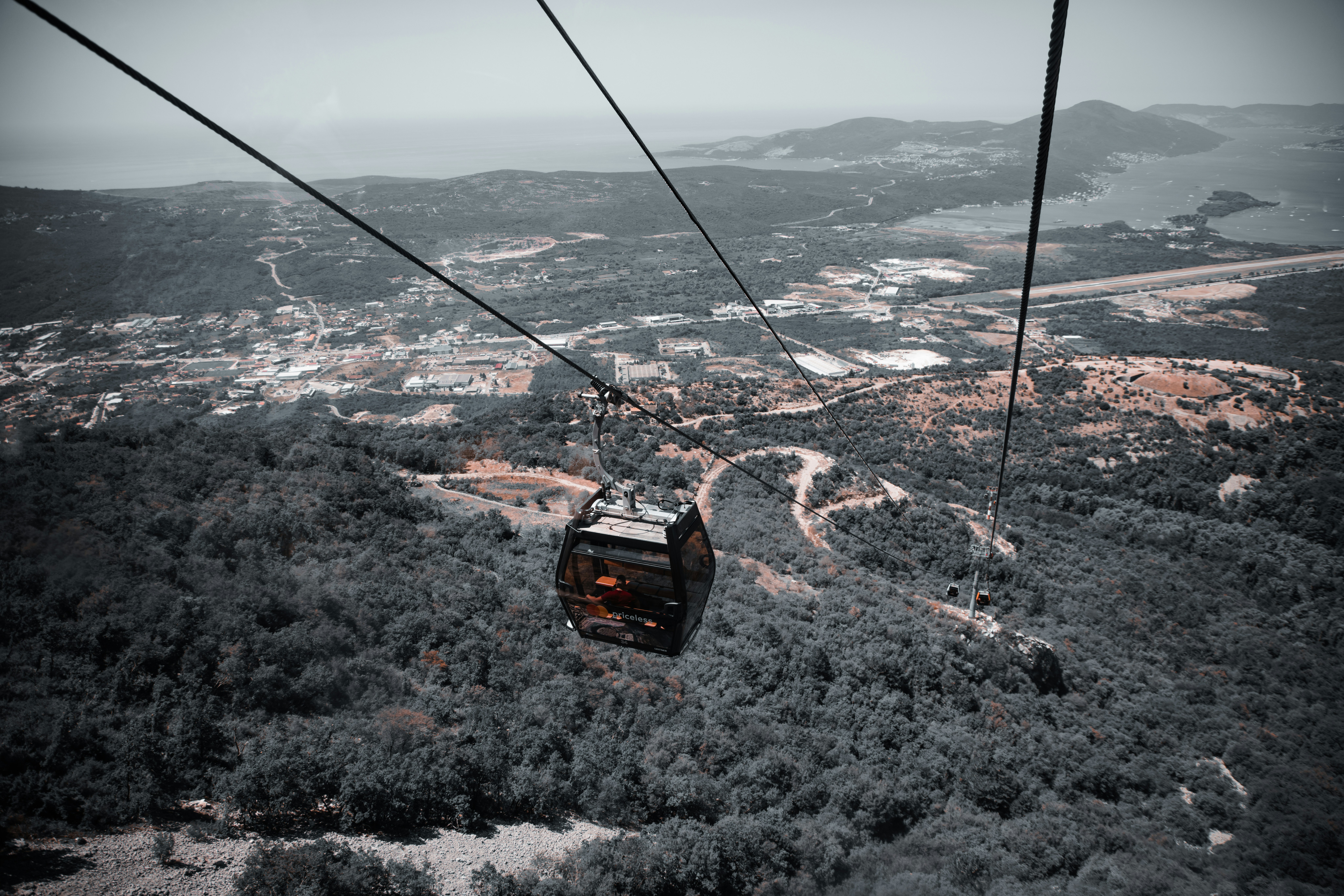 Cable Car Overlook: Aerial Descent Across a Verdant Valley