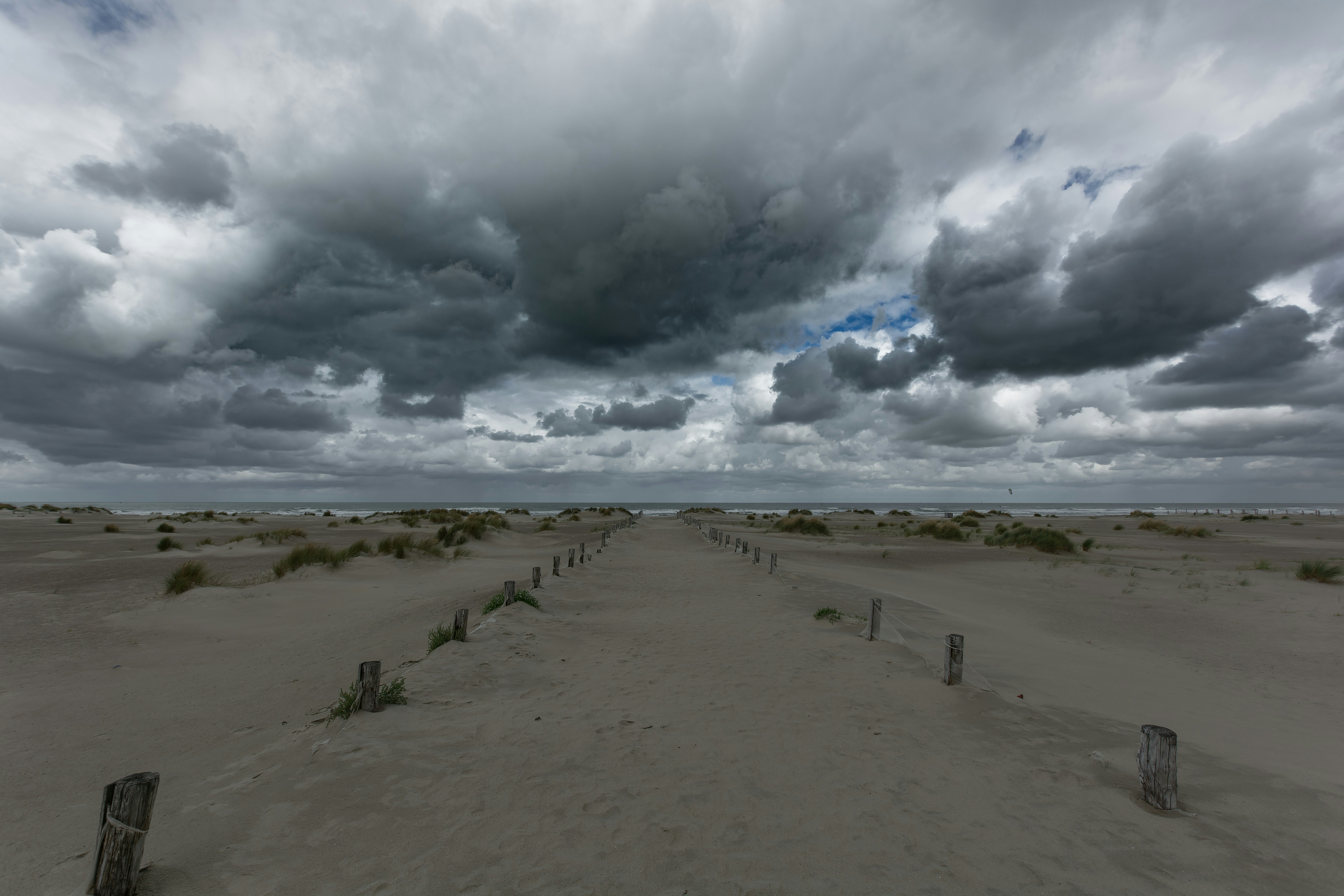 Path Through the Dunes Under a Brooding Coastal Sky