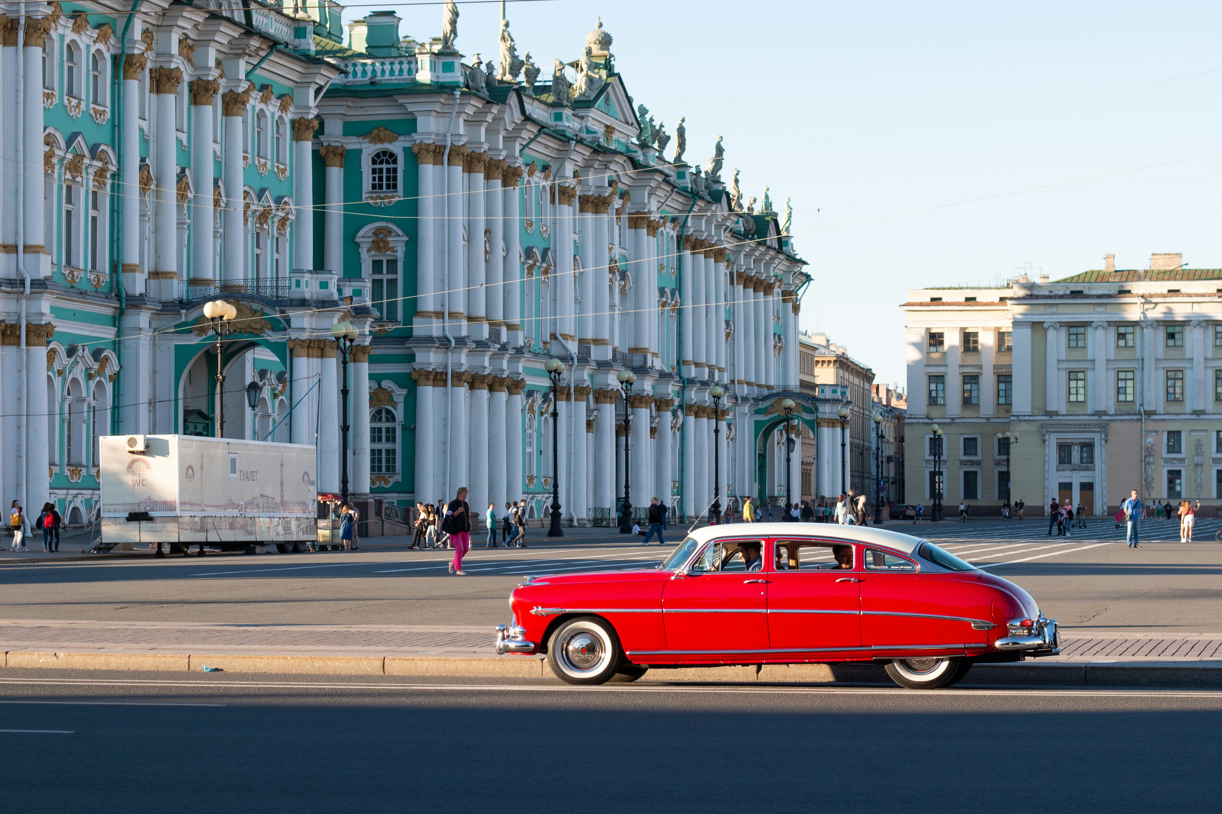 Red Classic Gliding along the Palace Quay
