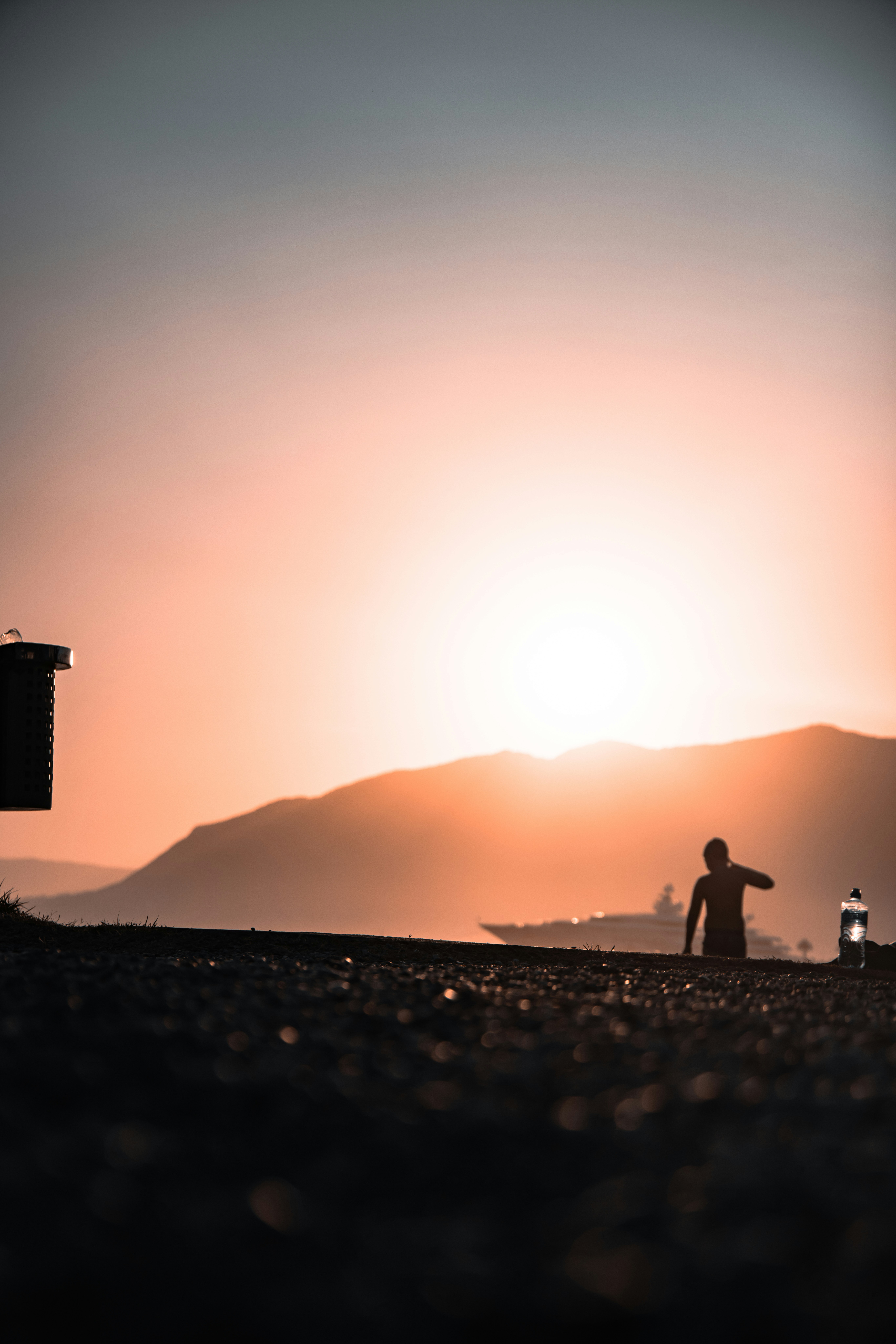 Sunset Silhouette: A Figure Points Toward the Horizon