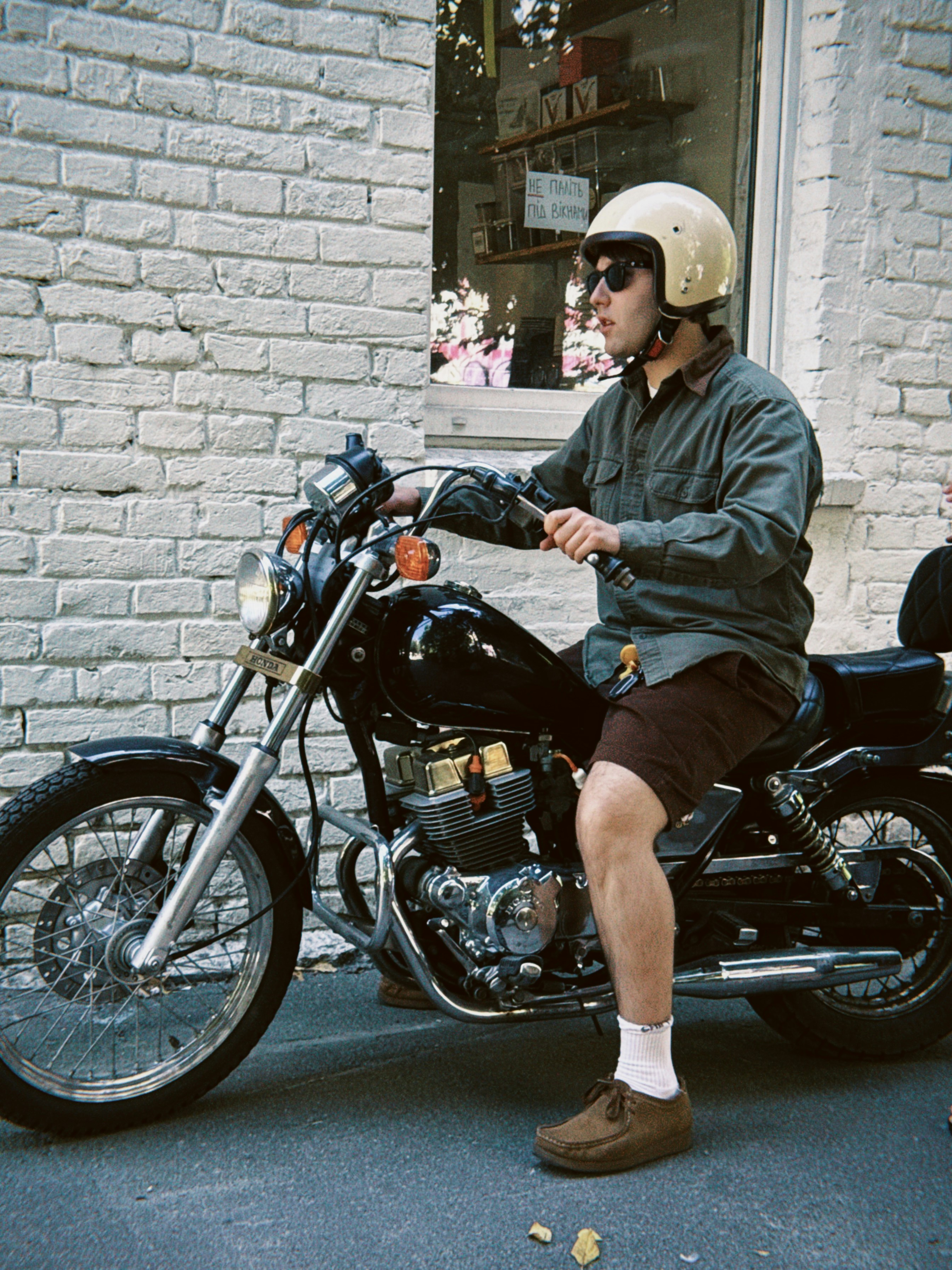 Rider in Retro Hue: A Quiet Moment on the City Street