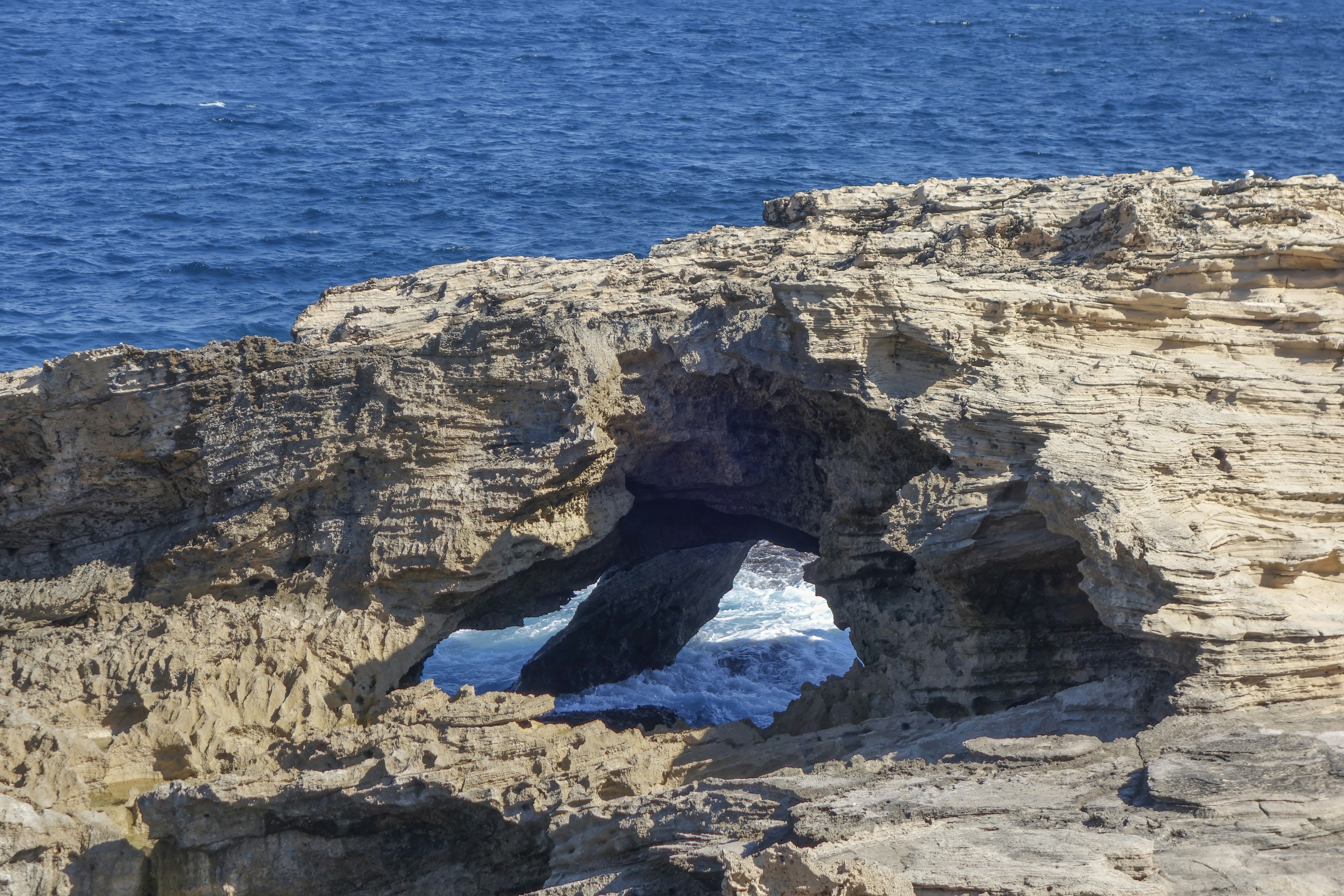 Coastal Stone Arch Framed by Turquoise Sea