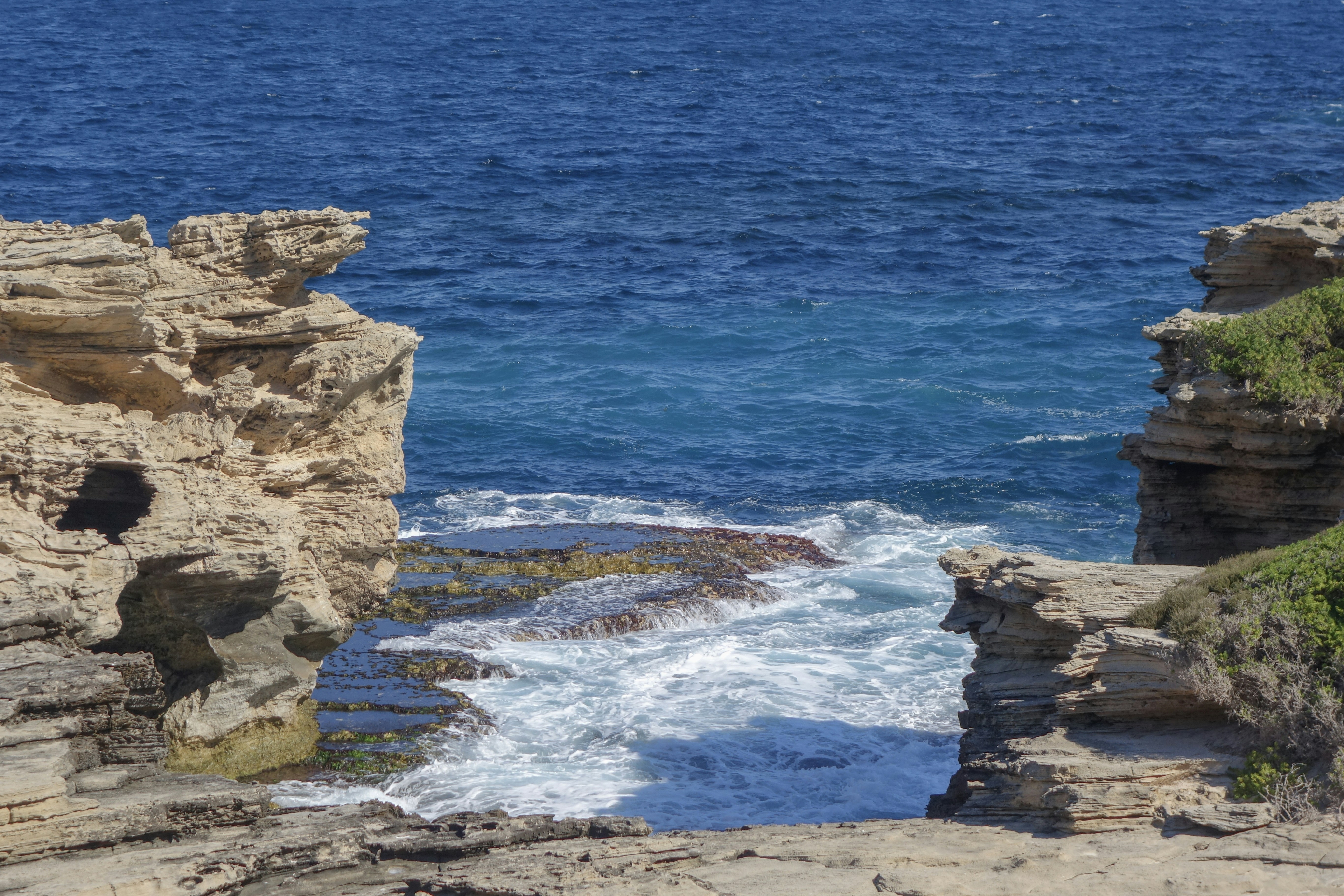 Terraced Sea: Craggy Coastal Steps Framing Turquoise Deep