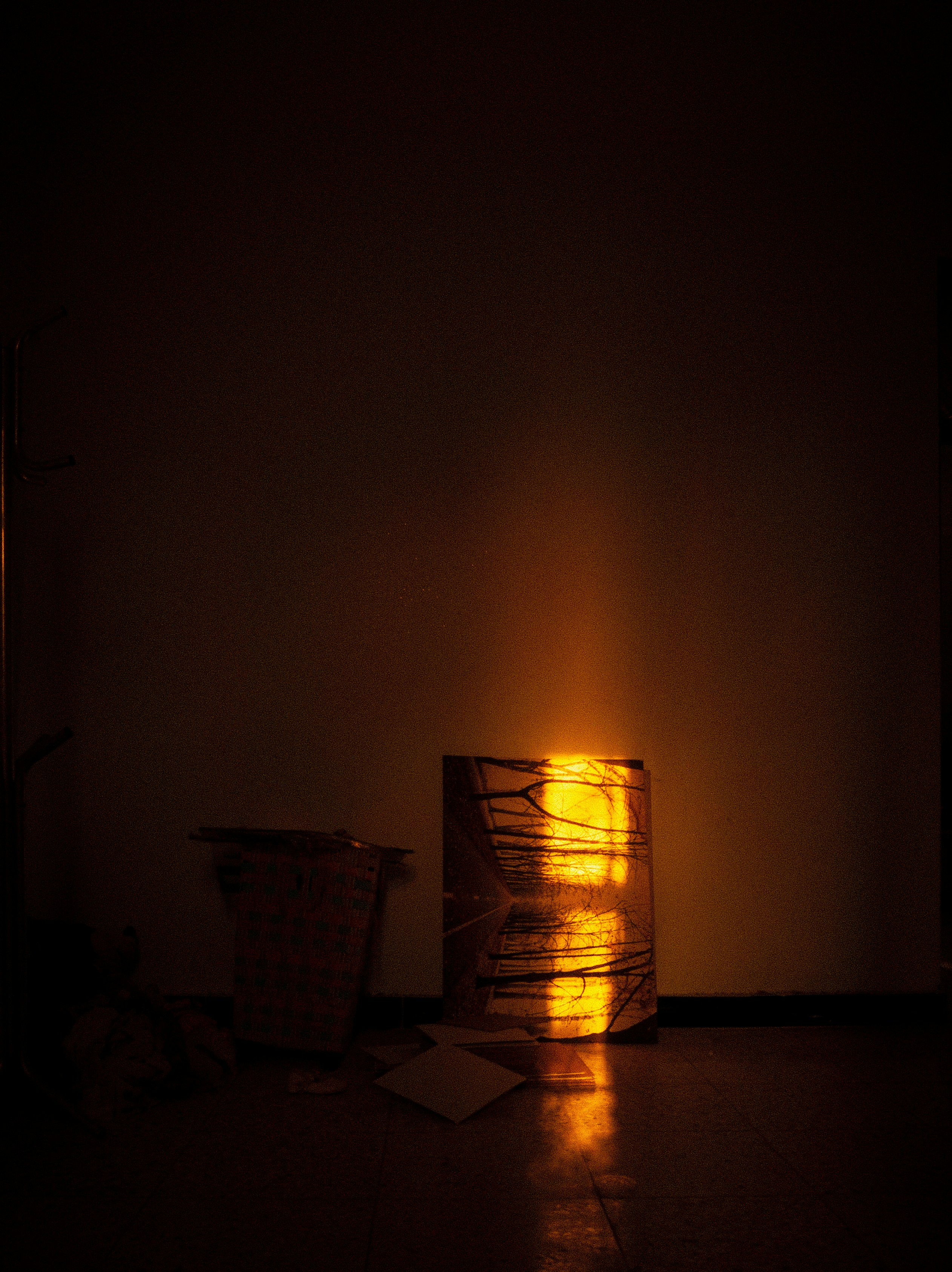 Ember Between Walls: A Glowing Cylinder in a Dim Room