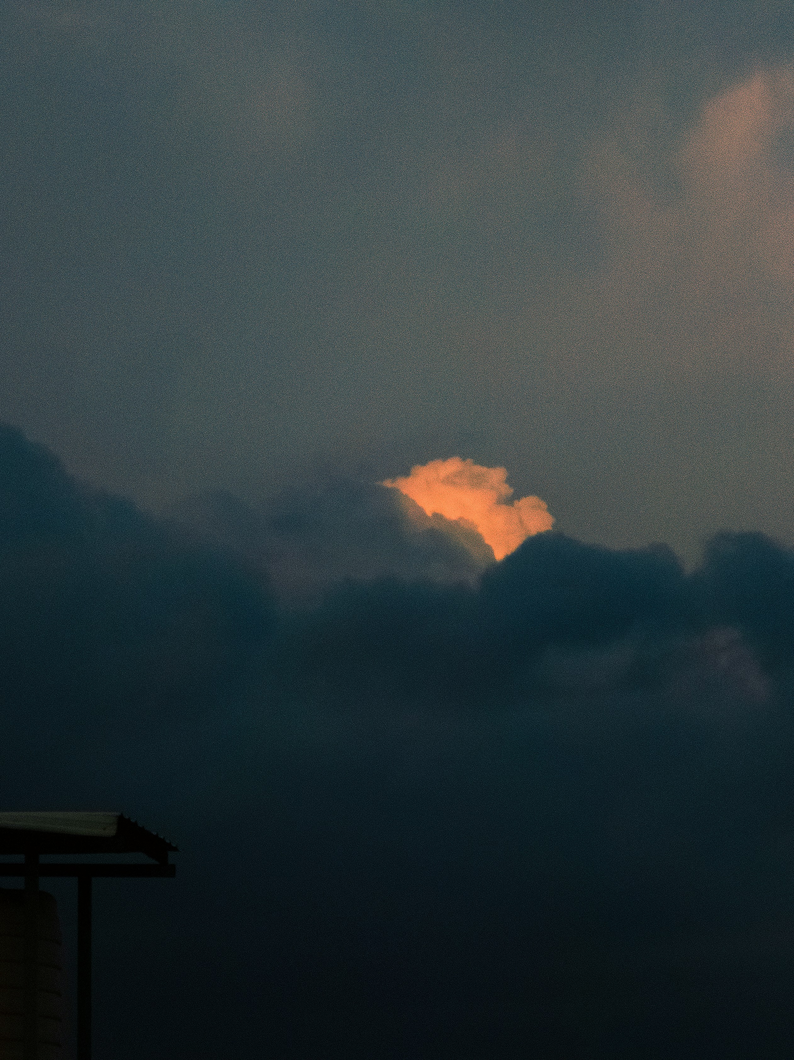 Midway Burst: A warm glow in the low clouds