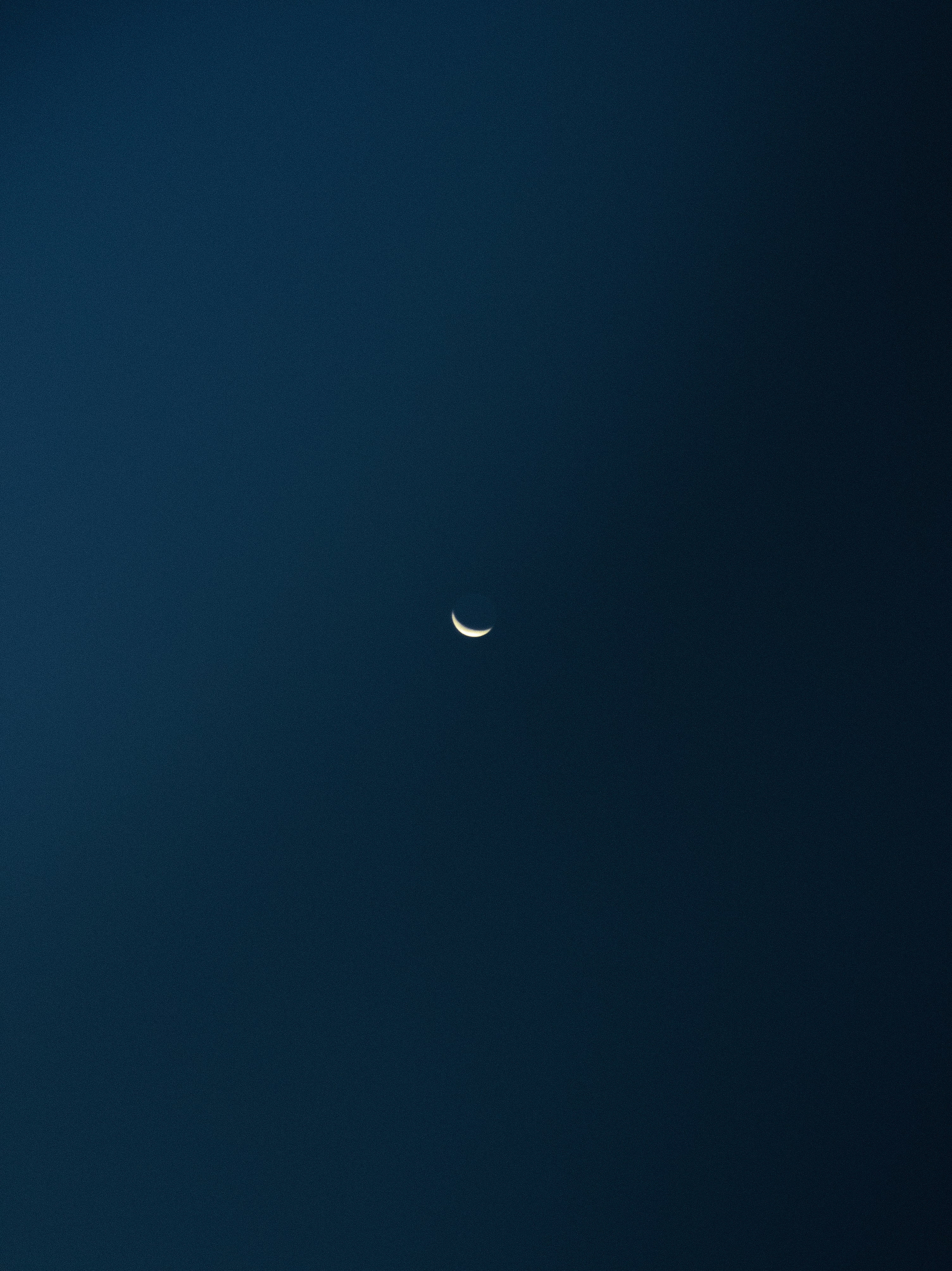 Moonlit Crescent: A Quiet Moment in Deep Night Blue