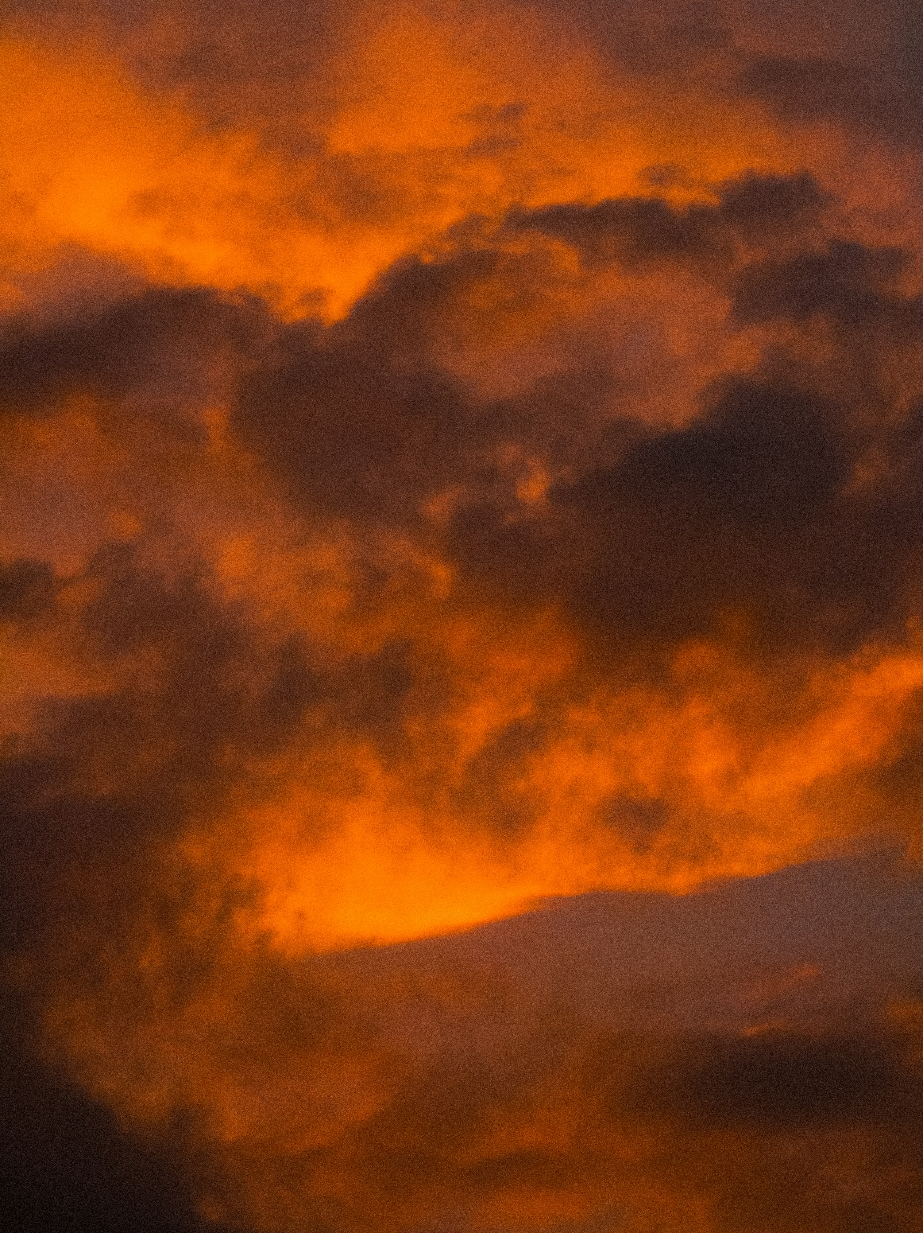 Ember Skies: A Quiet Bank of Clouds at Dusk