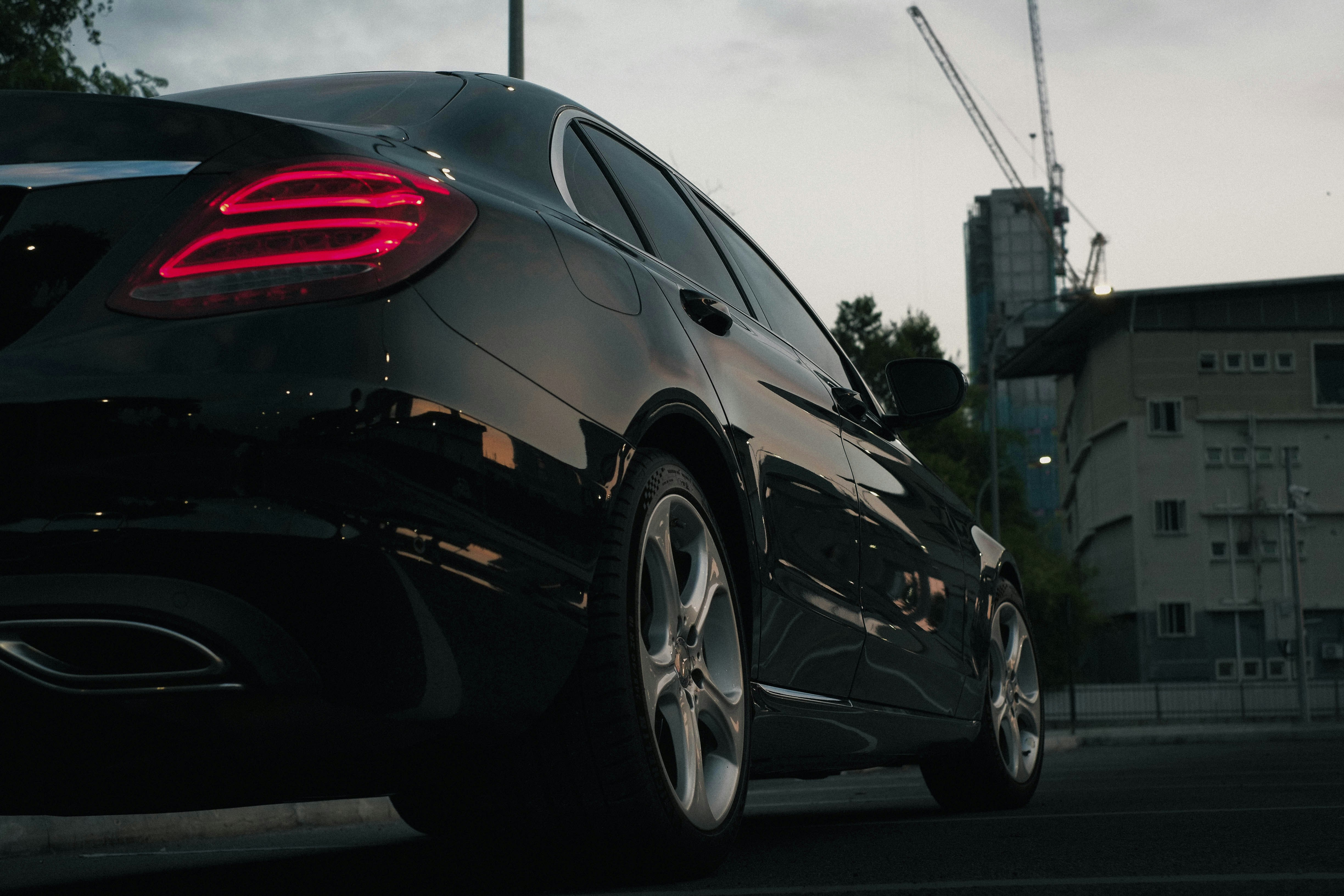 Low-Angle Silence: The Car at the Edge of a Construction City