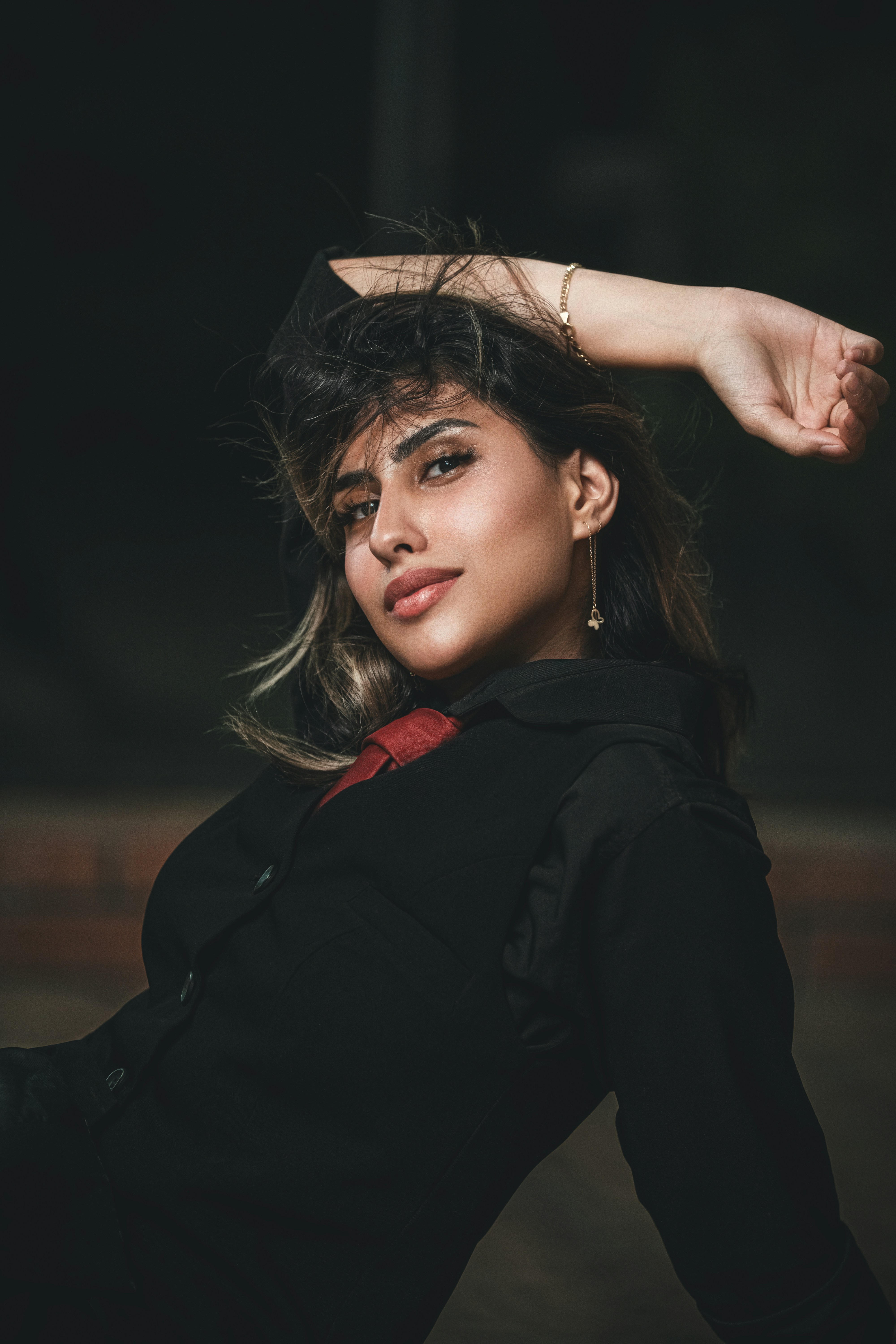 Shadowed Grace: A Confident Gaze in Dusk Portrait