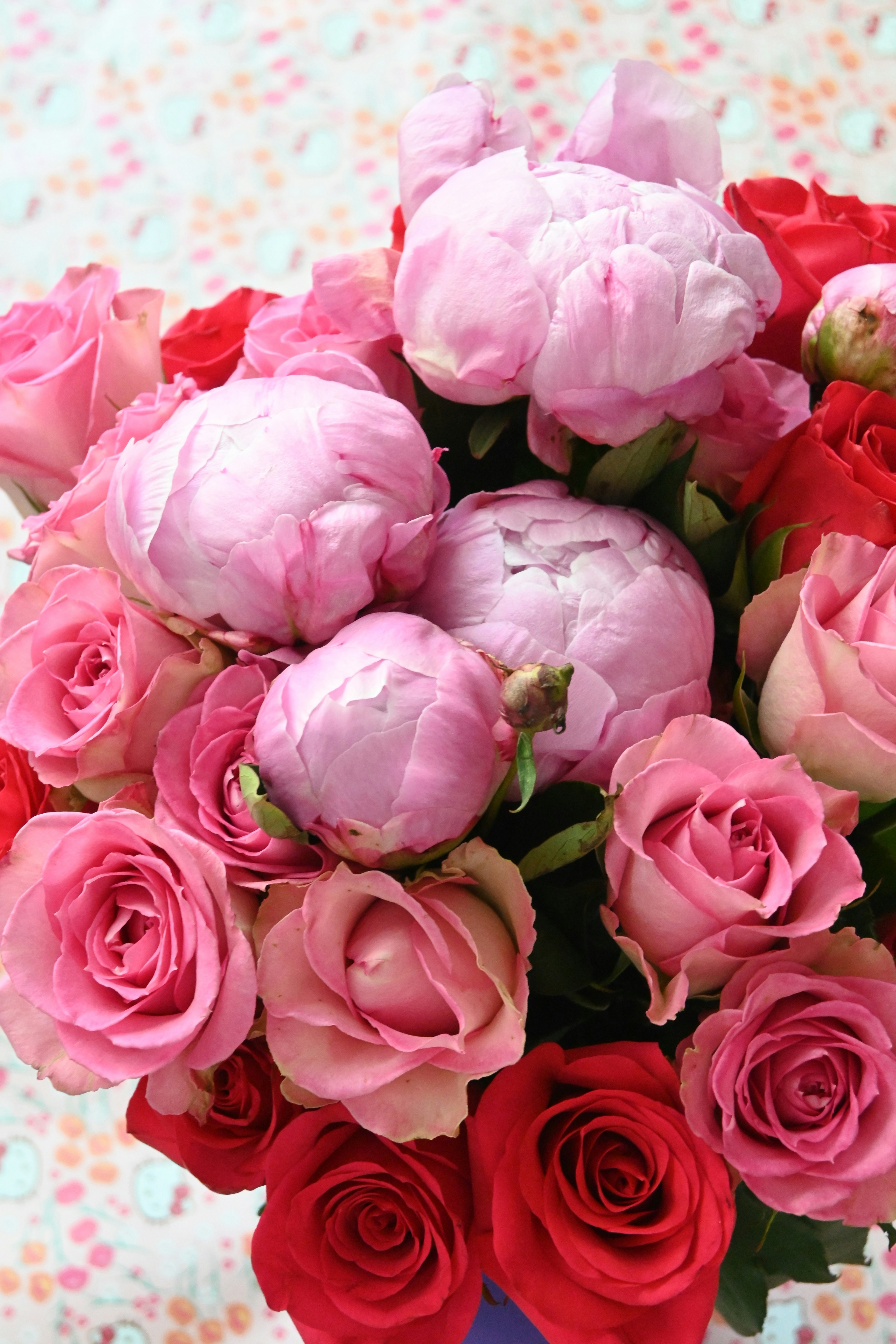 Blush bouquet in bloom: a sea of pink roses and peonies