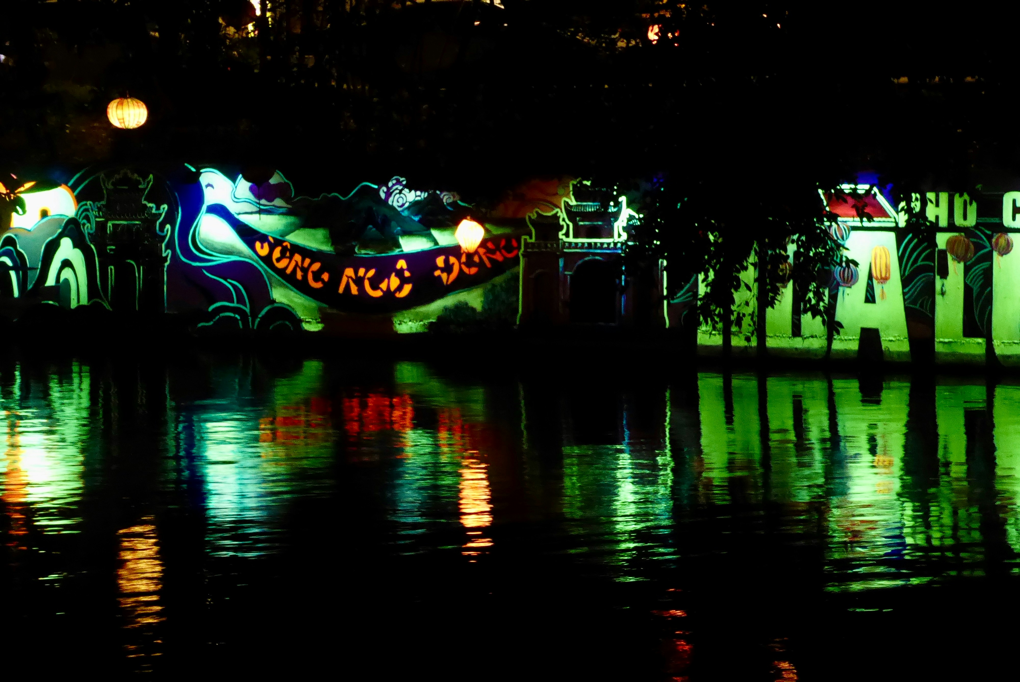 Neon Reflections on a Midnight Canal