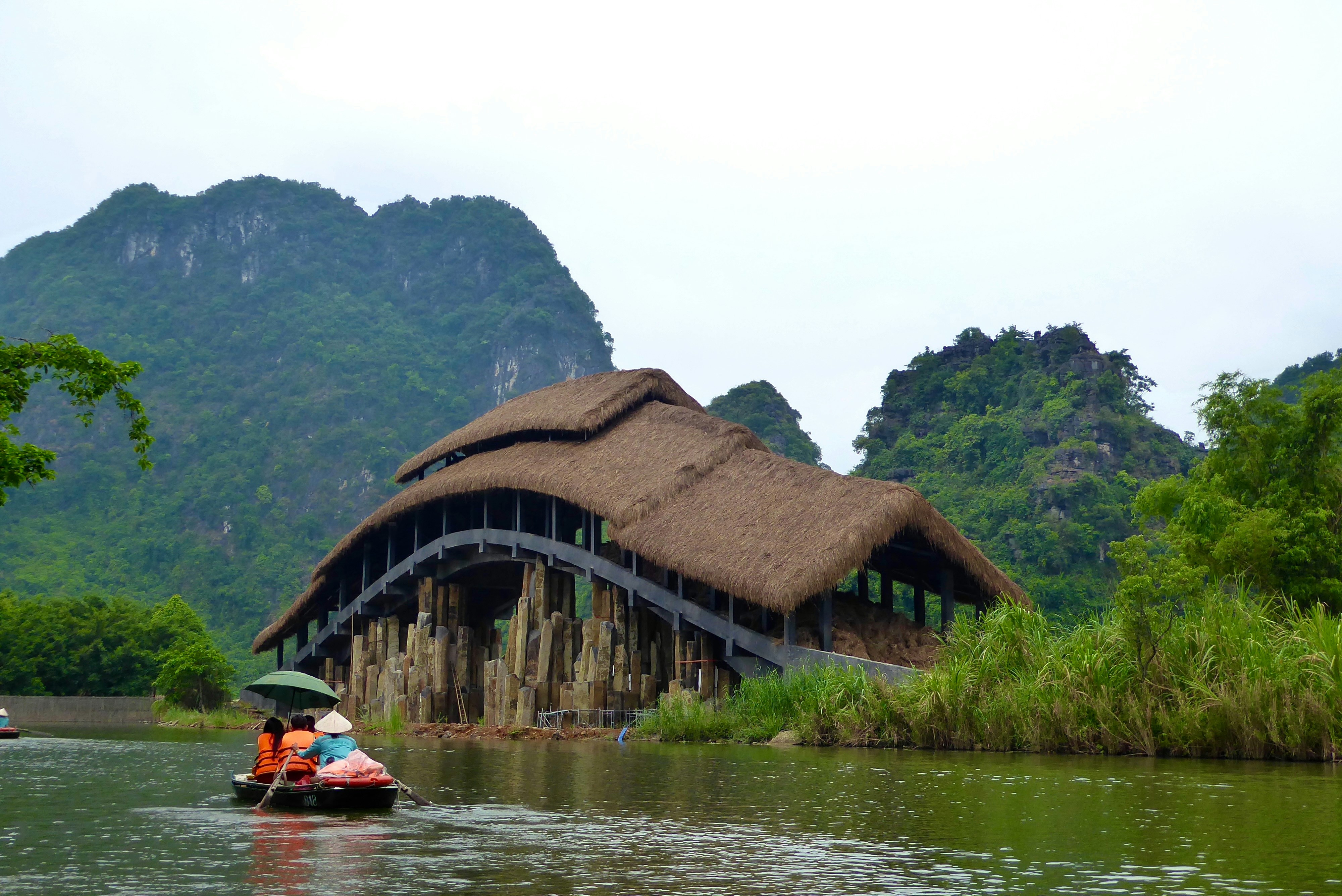 Thatched-roof Pavilion on a Quiet River