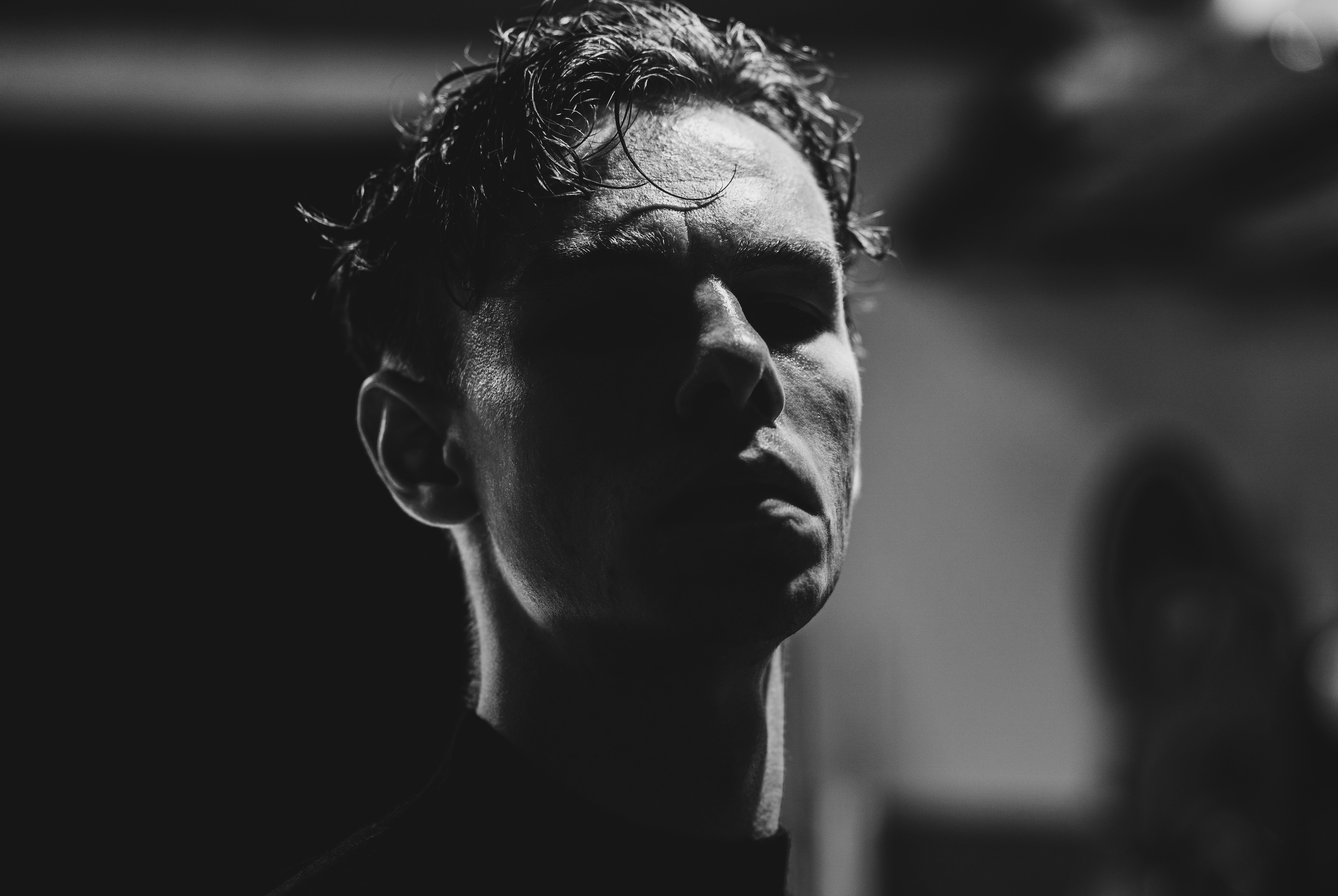 Chiaroscuro Portrait: A Shadowed Gaze in the Studio