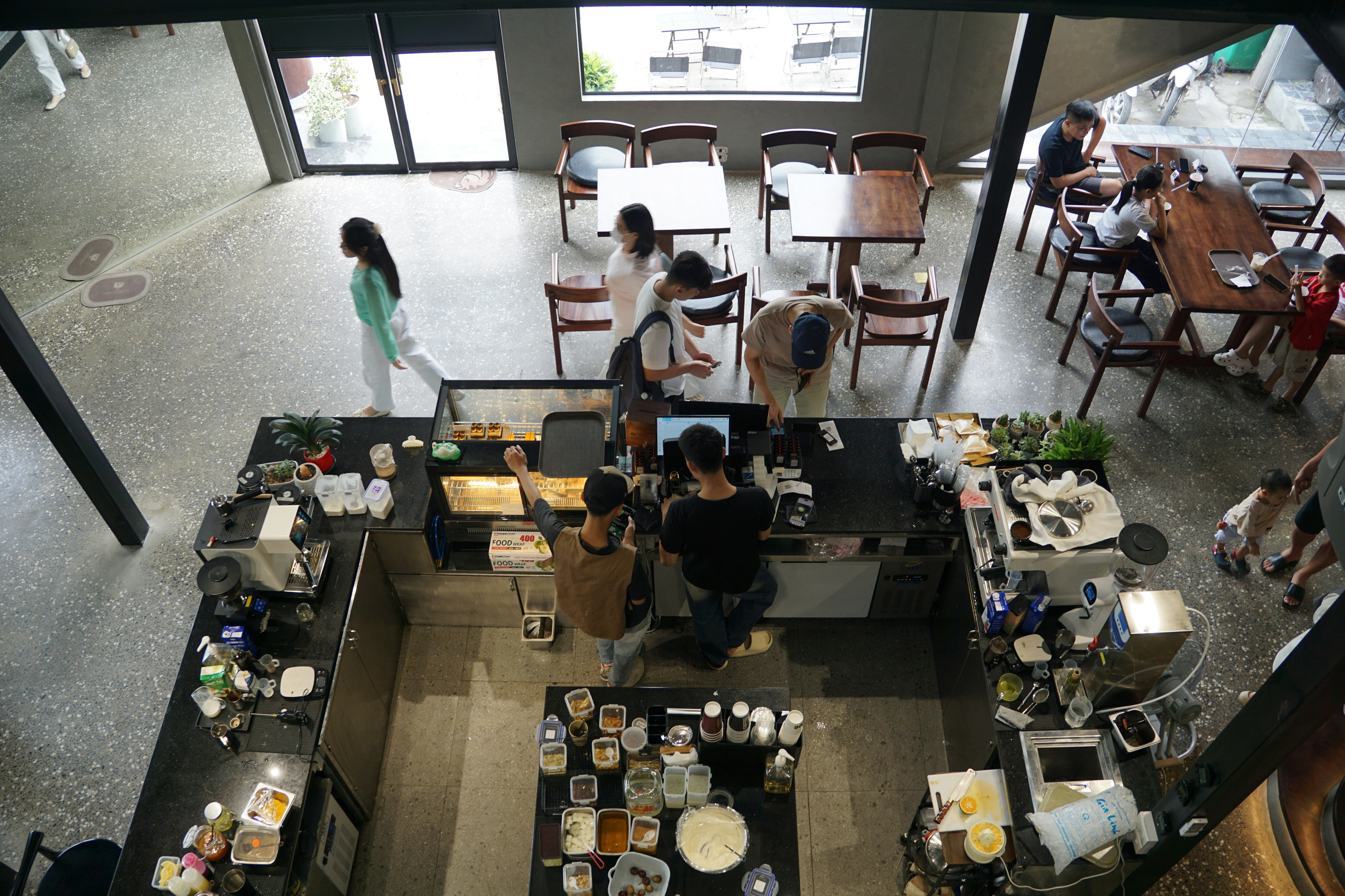 Overhead Café Flow: Barista Counter and Social Slice