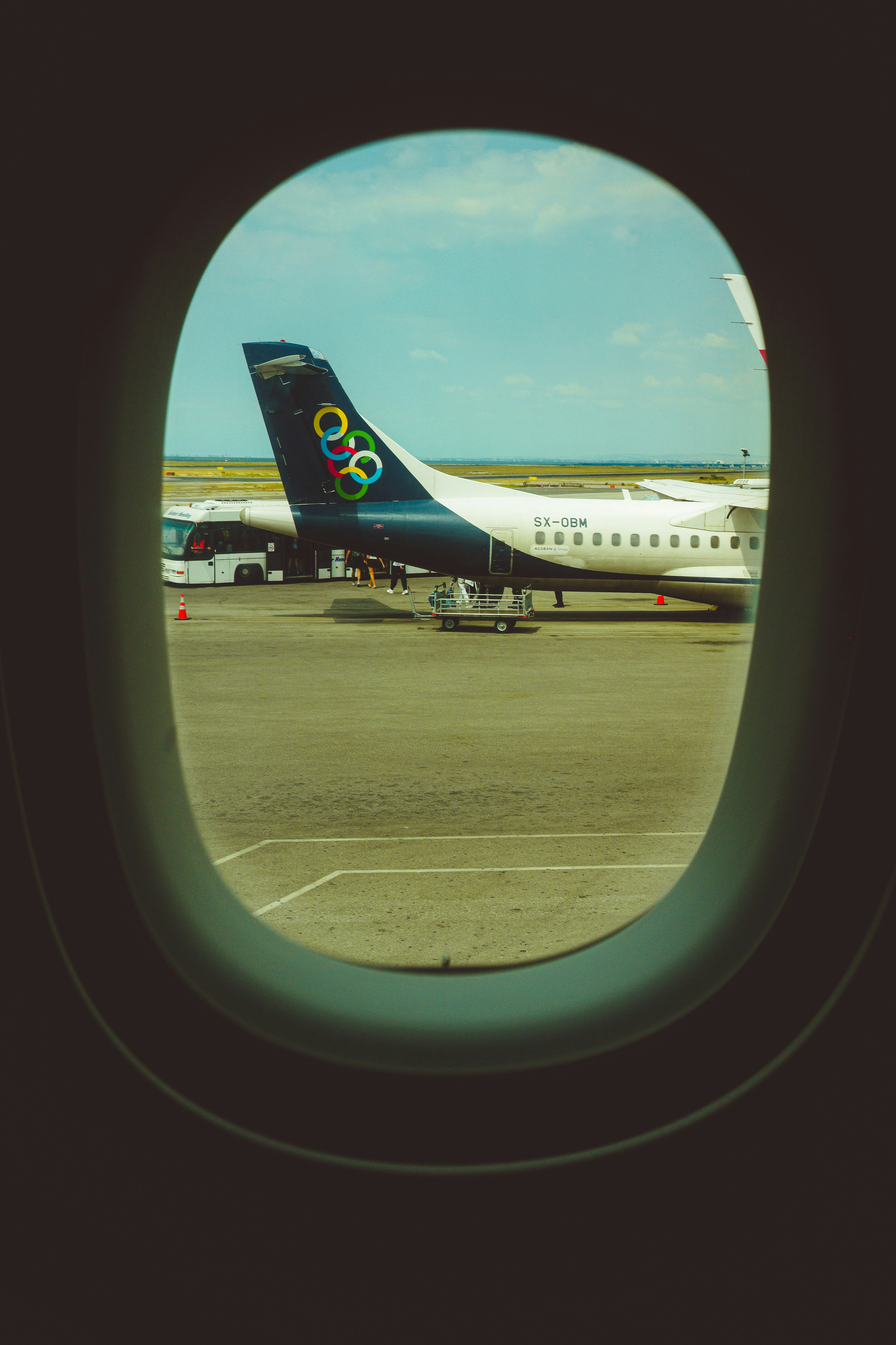 Olympic Tailwinds: A Quiet View Through the Passenger Window