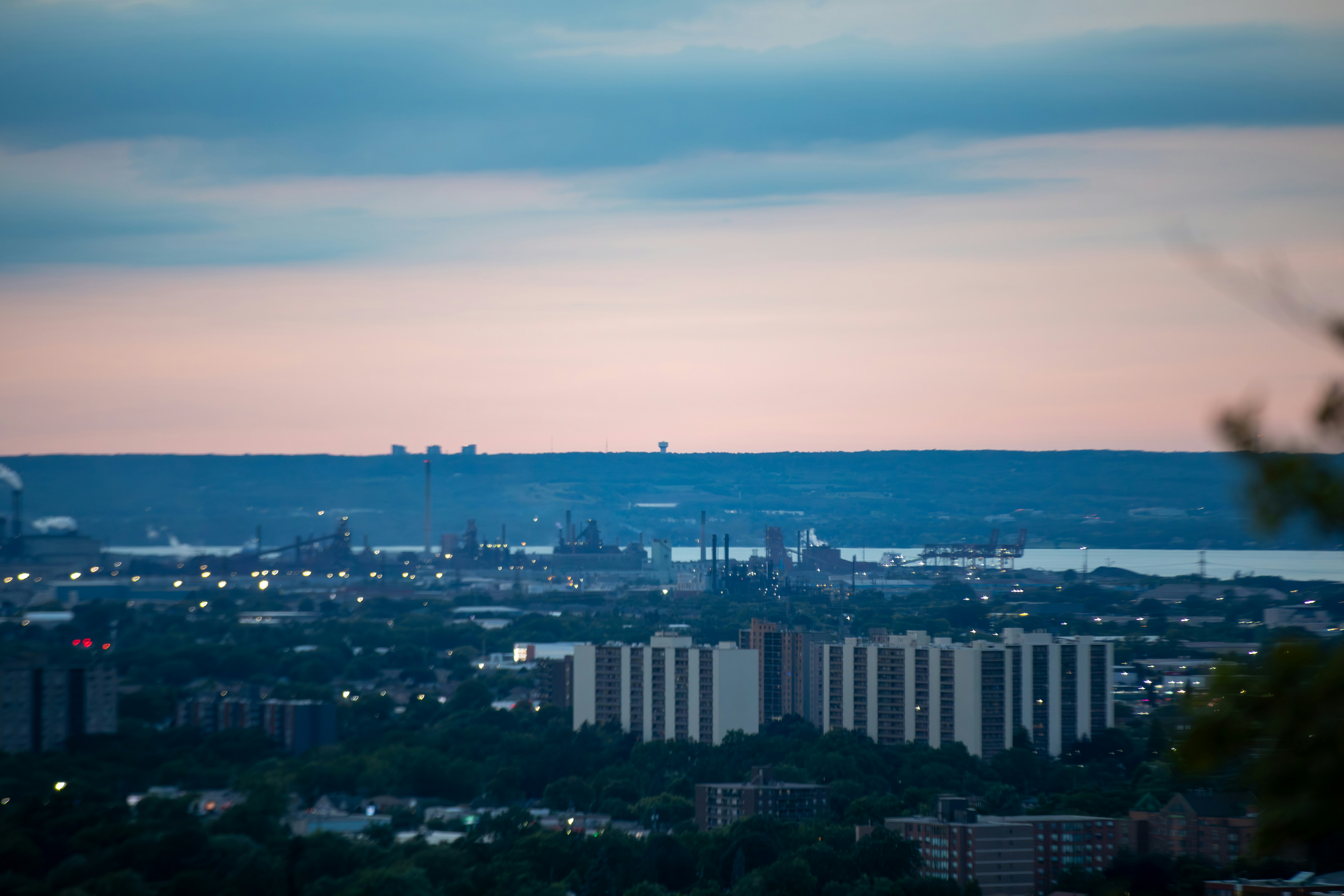Distant Cityscape at Dusk: A Quiet Horizon Over Buildings and Water