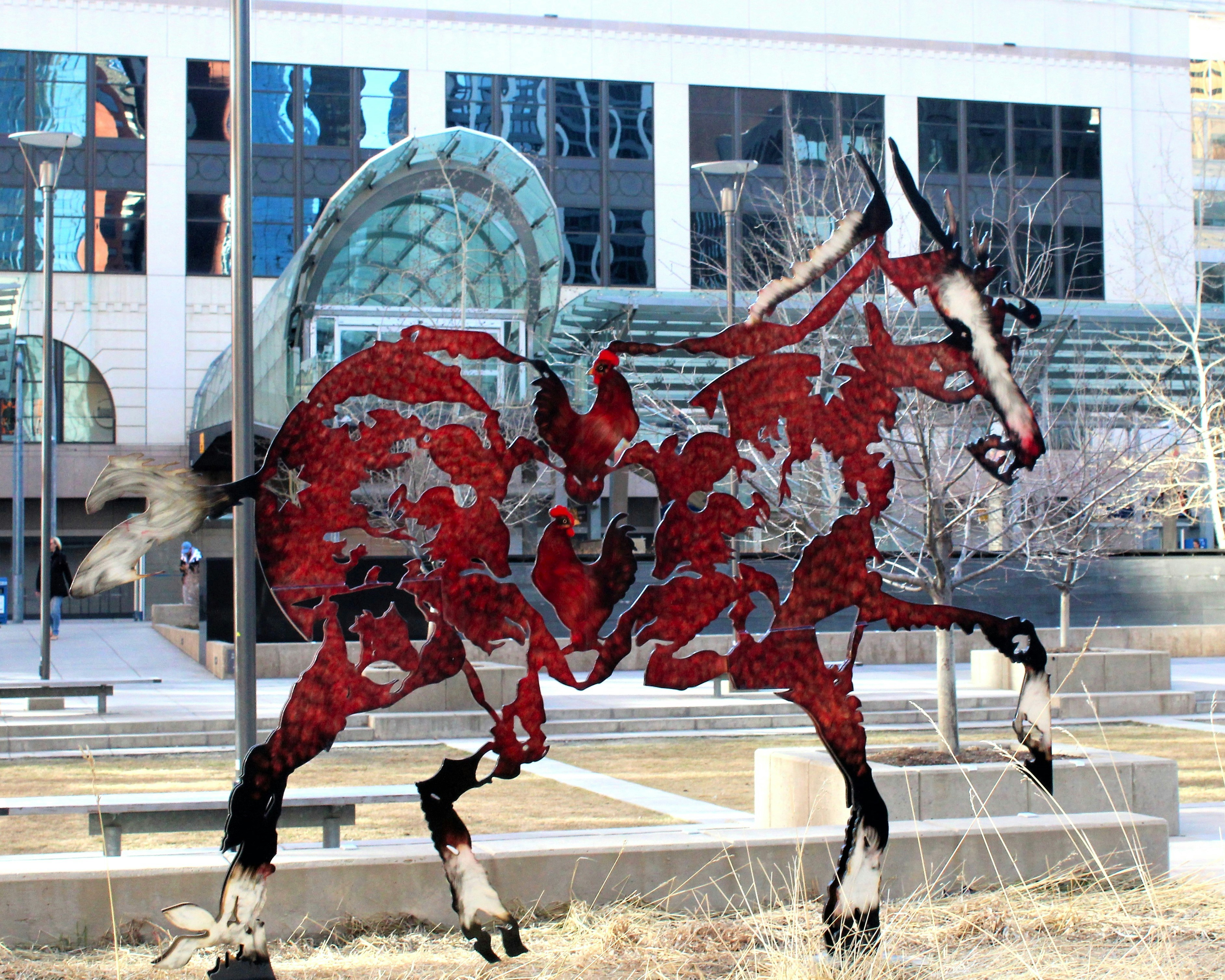 Metallic Red Equine: Sculpted Horse in an Urban Courtyard