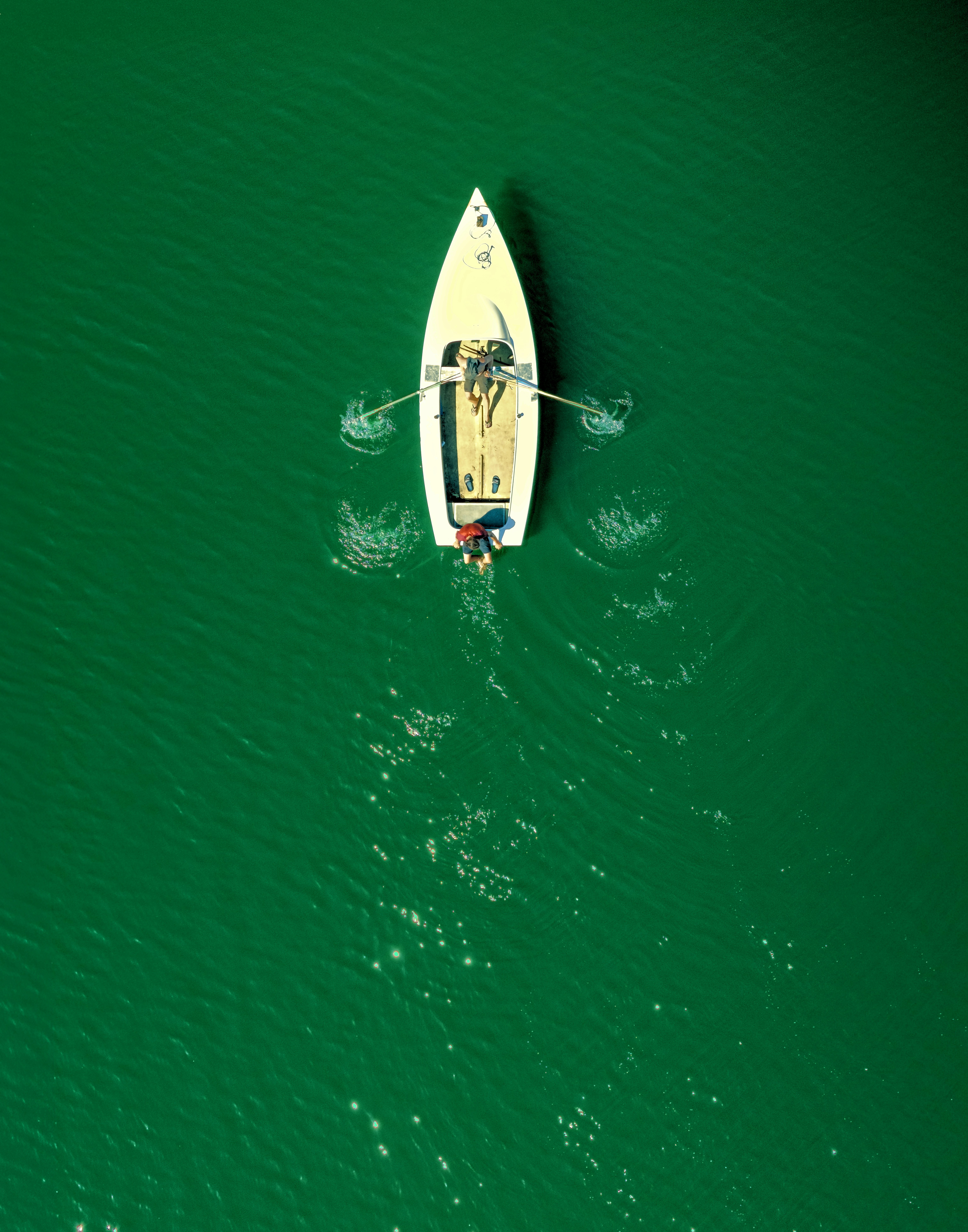 Centered Sail: A Top-Down Kayak in Emerald Seas