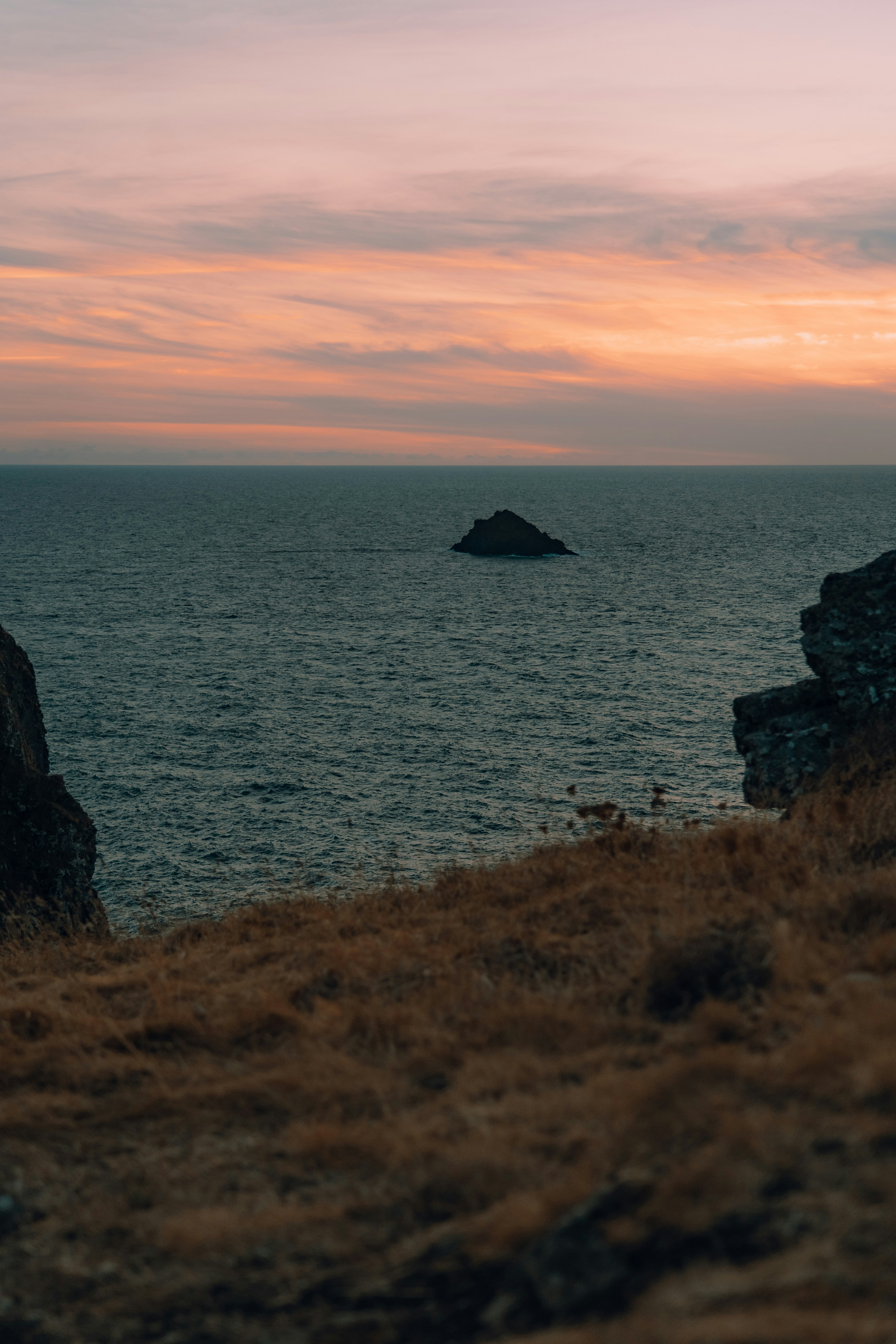 Ocean Standoff at Sunset over a Lone Island