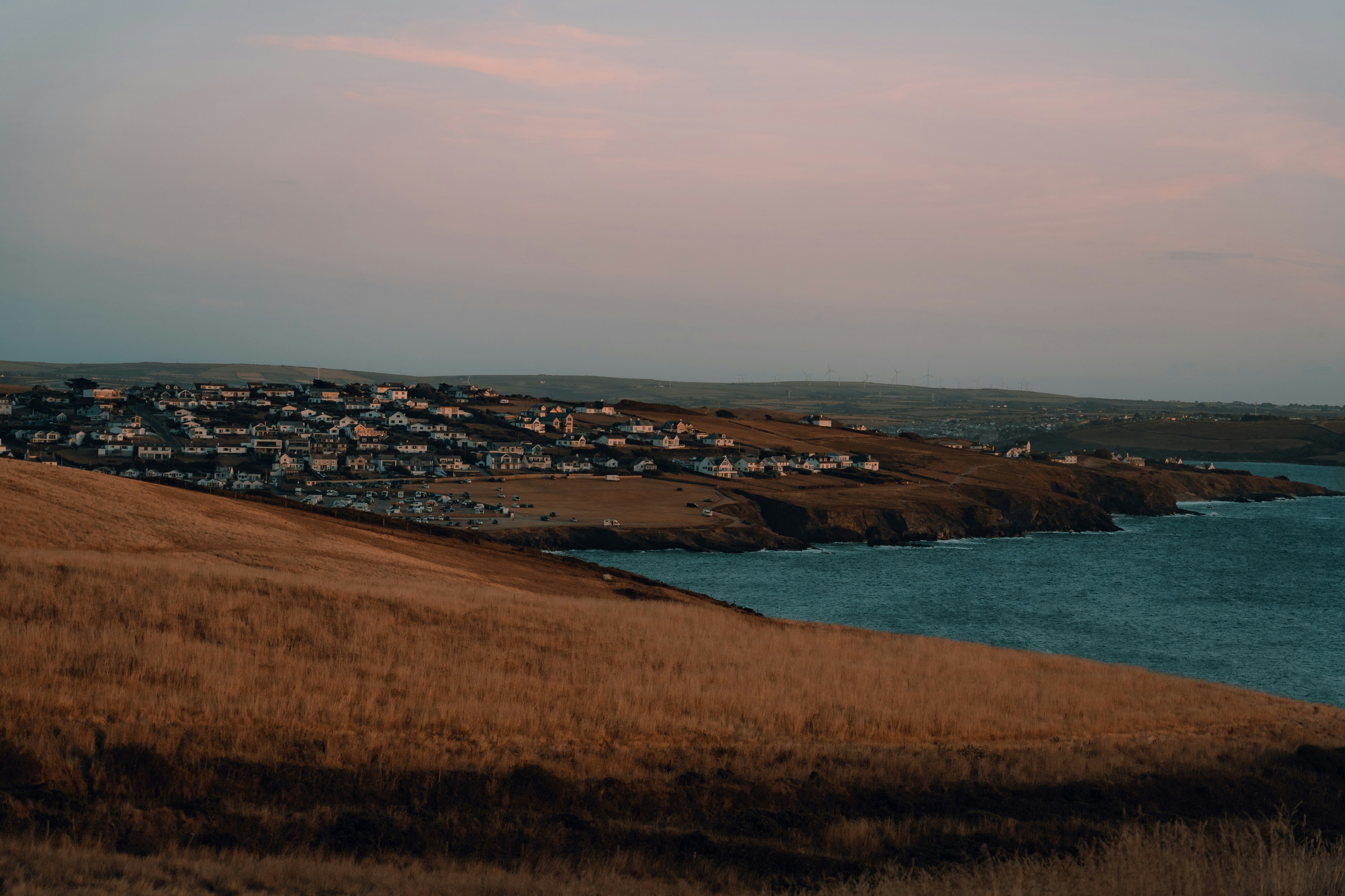 Coastal Dune Panorama Over a Quiet Coastal Village at Dusk