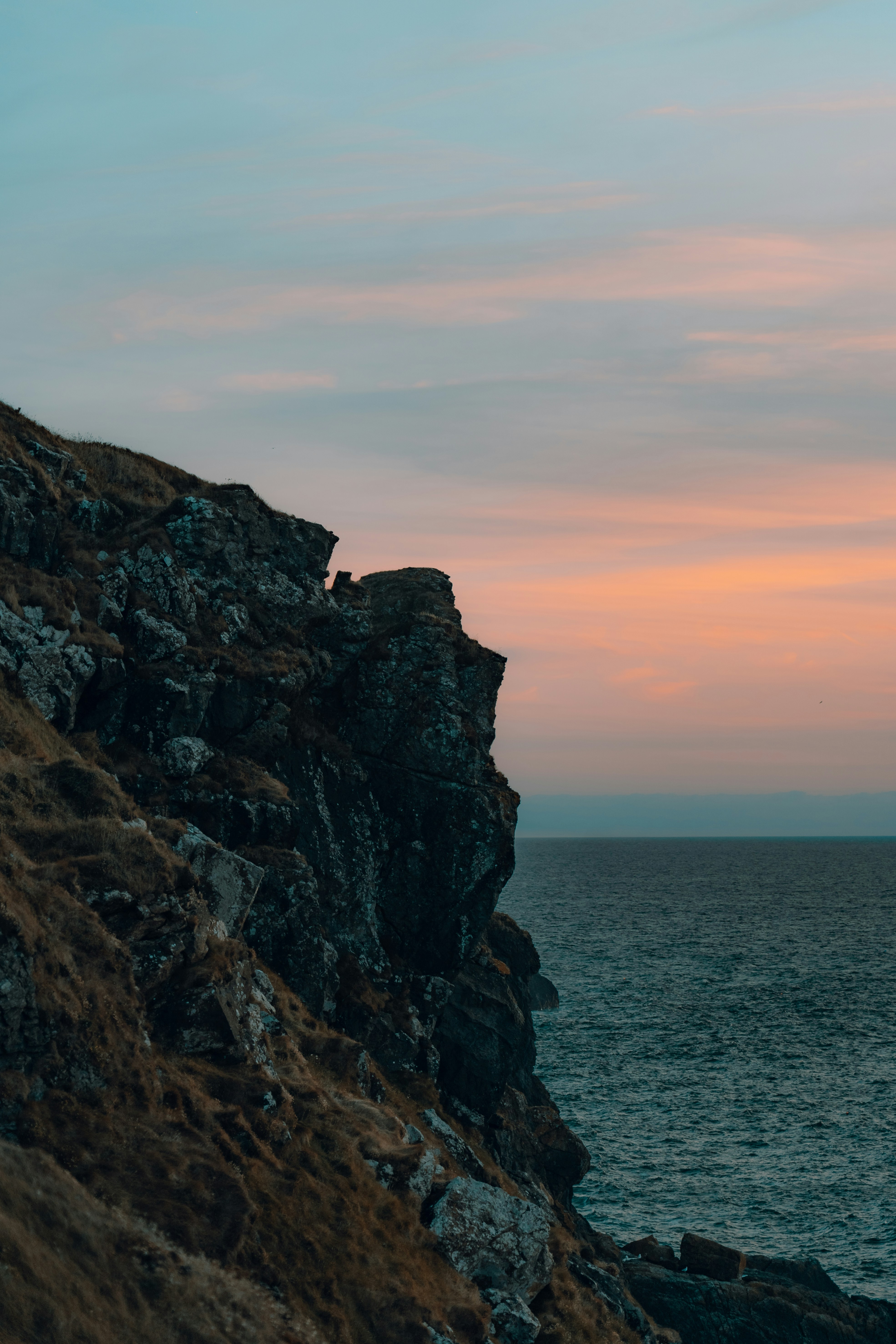 Cliffside Twilight: Edge of the Blue Horizon