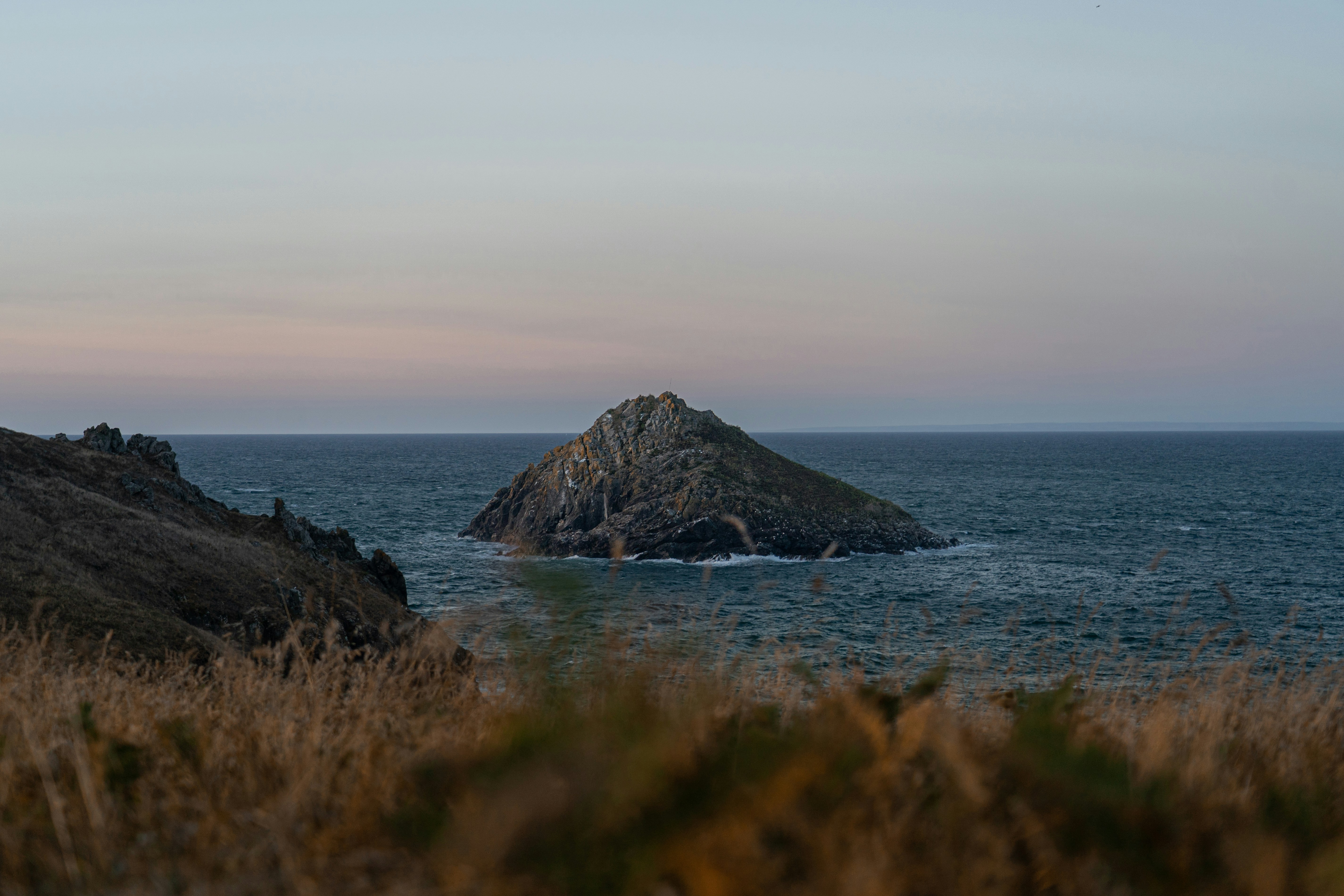 Islet in the Quiet Sea: Dusk Touches the Crest