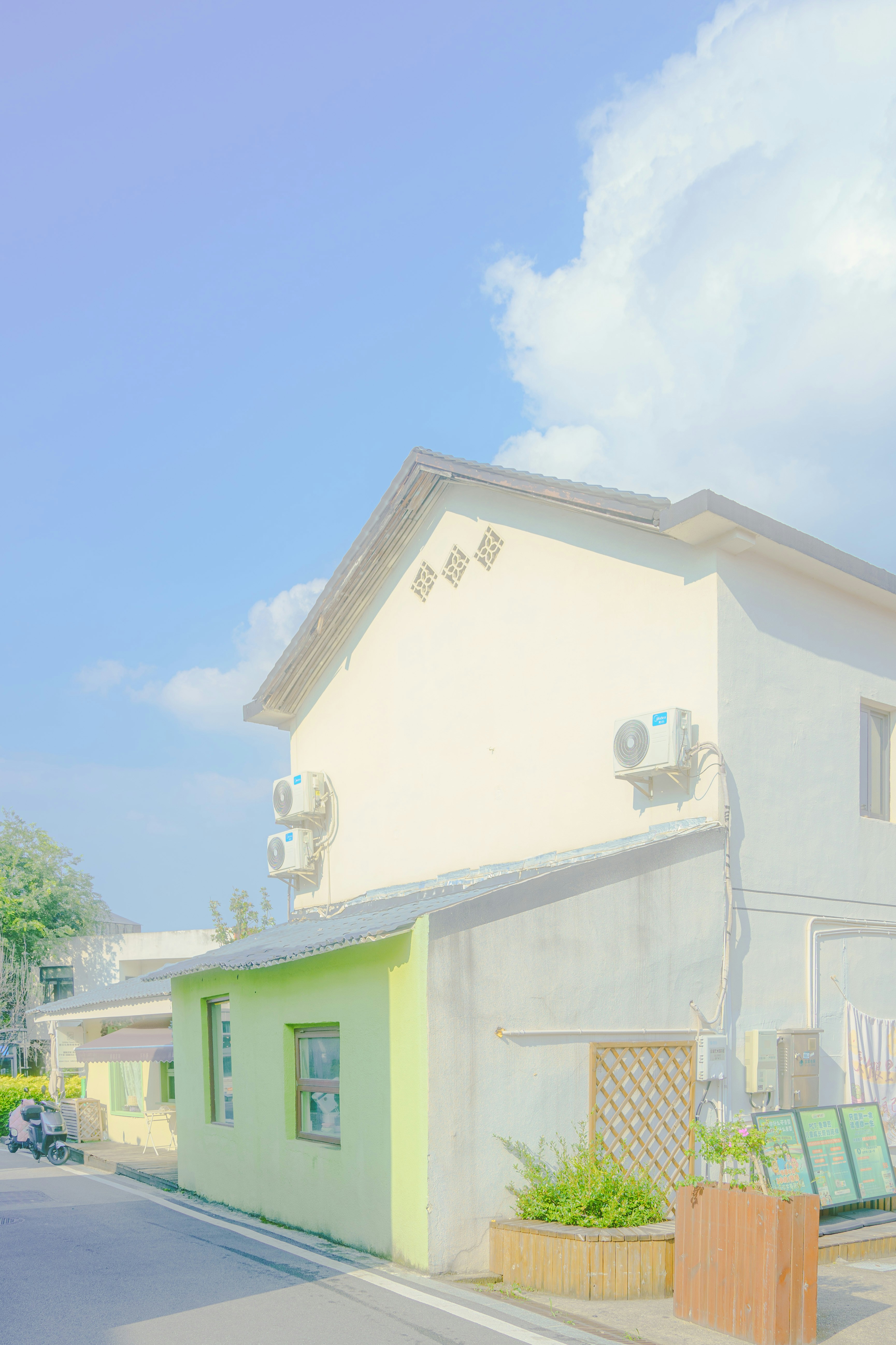Pastel Corner: A Sunlit Building With Air Conditioning Units