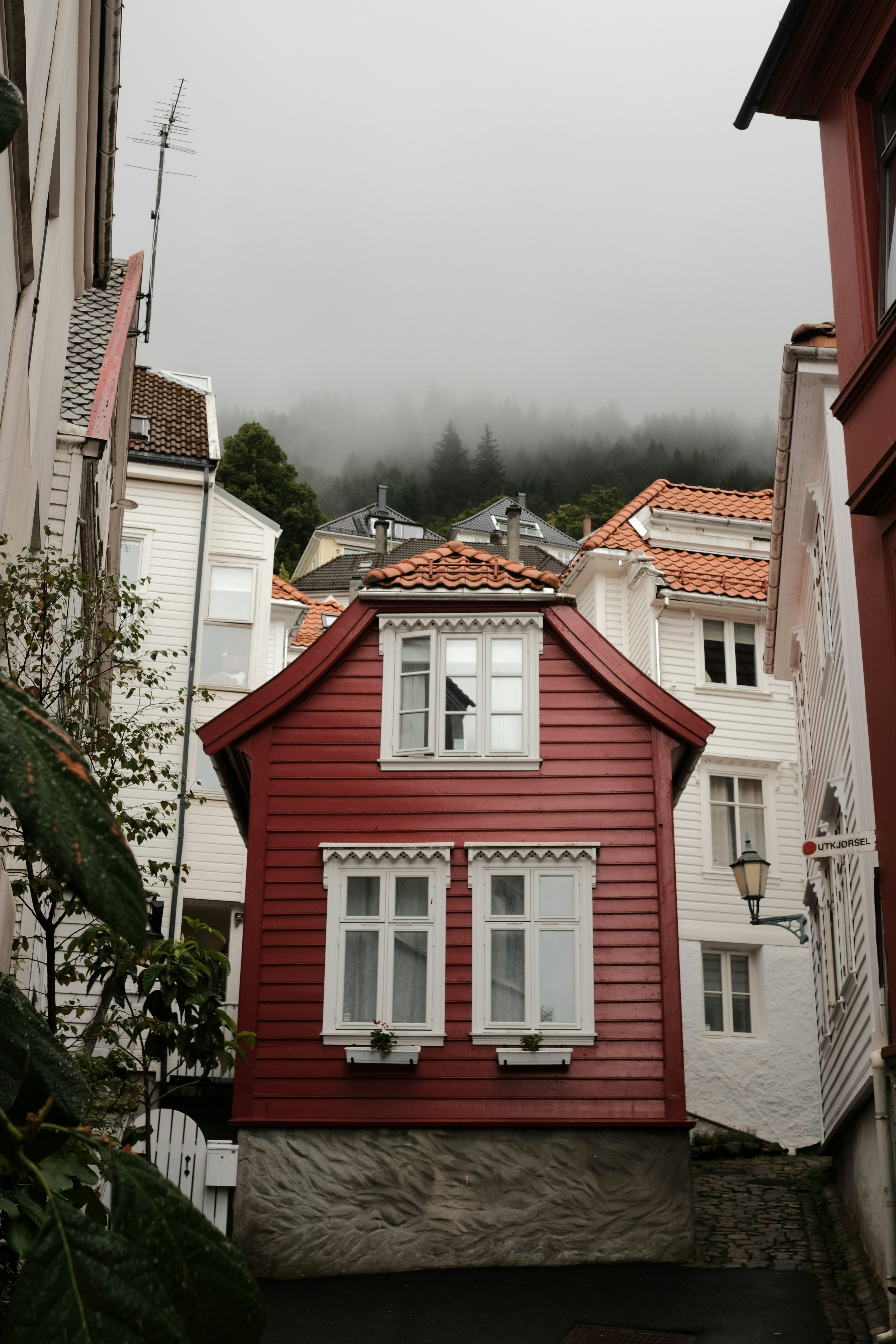 Red Barn in a Foggy Norwegian Alley