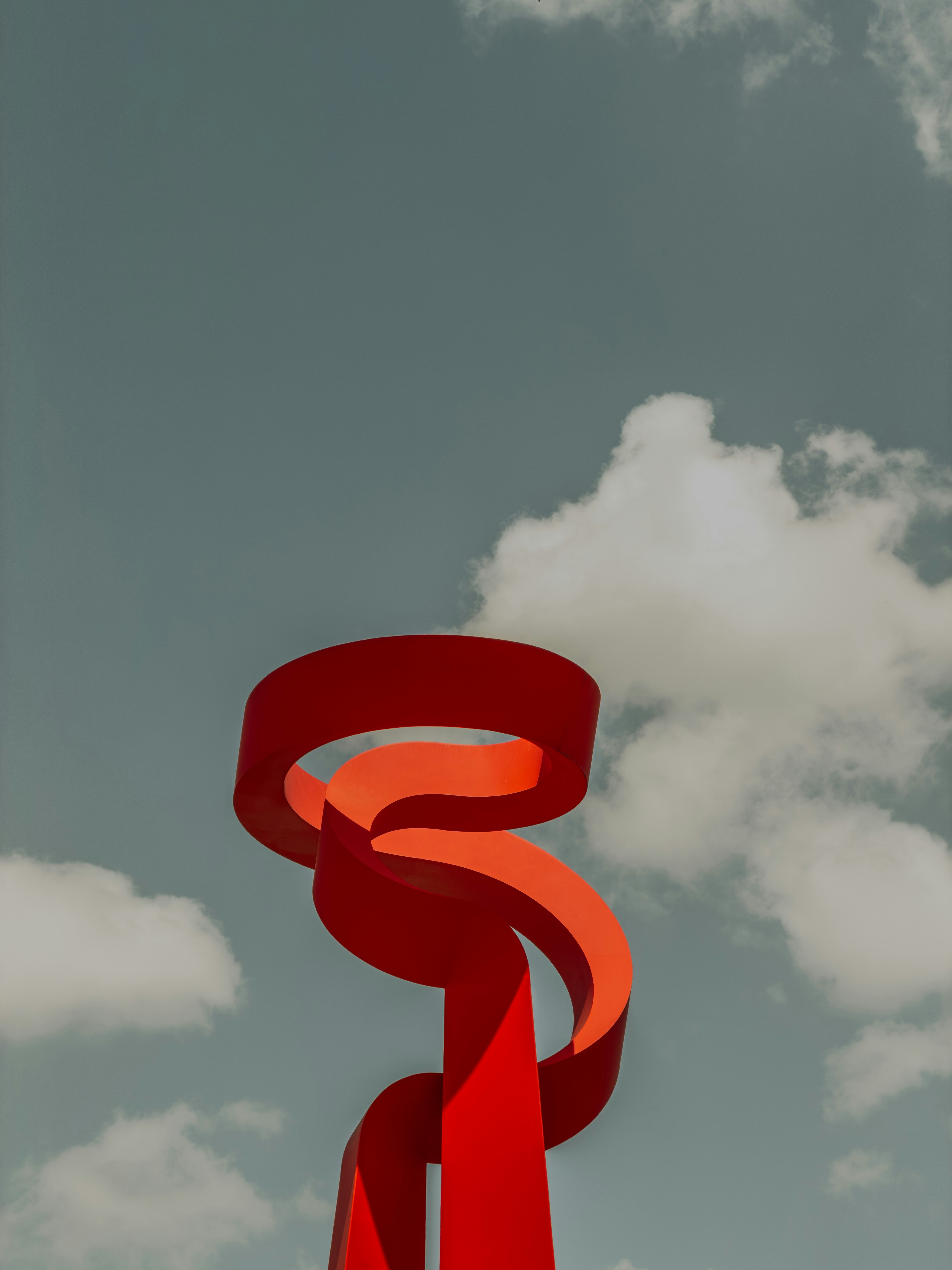 Coiled Inferno: A Red Ribbon Rising into the Sky
