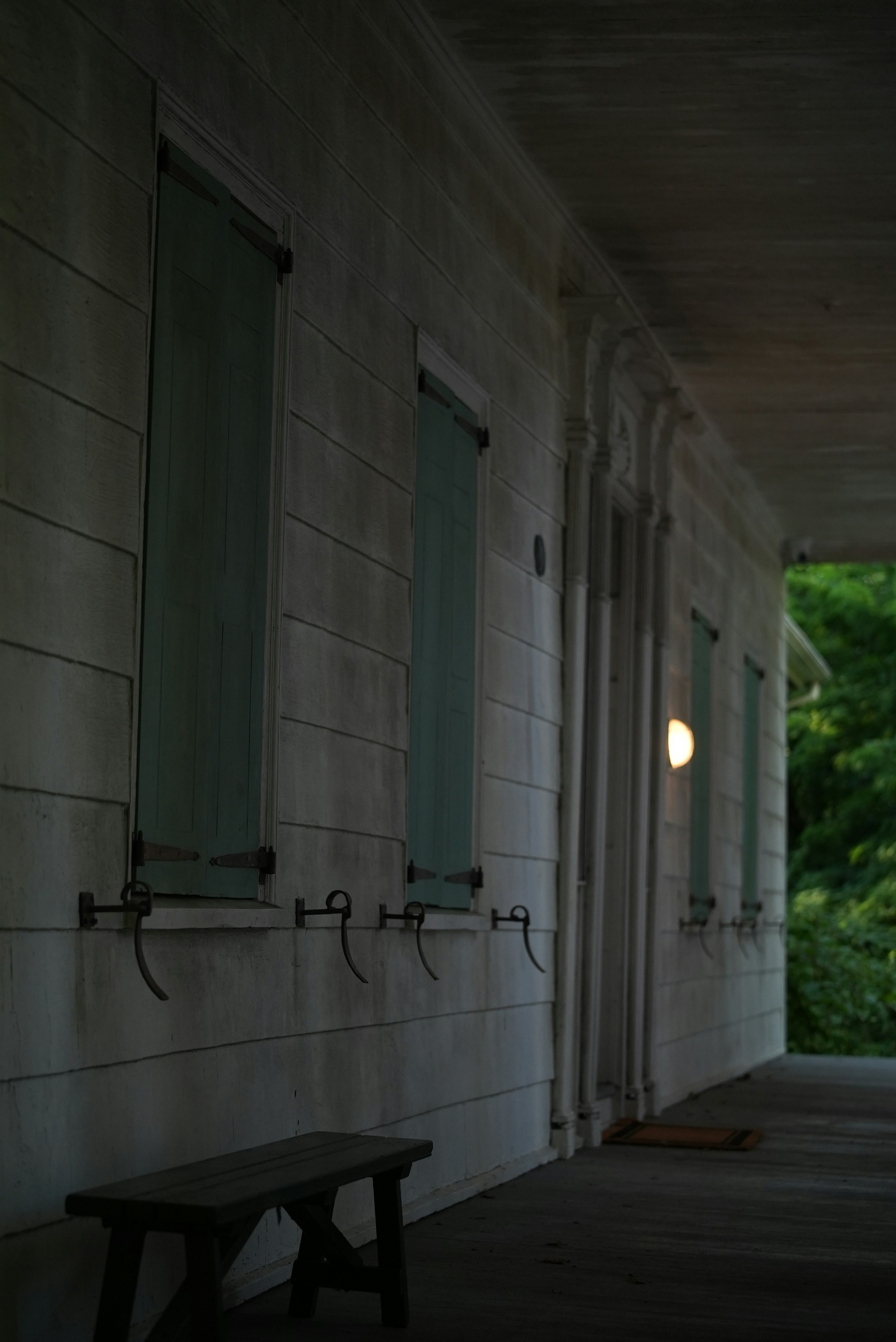 Quiet Corridor of Light: A Sunlit Doorway in the Deep Porch