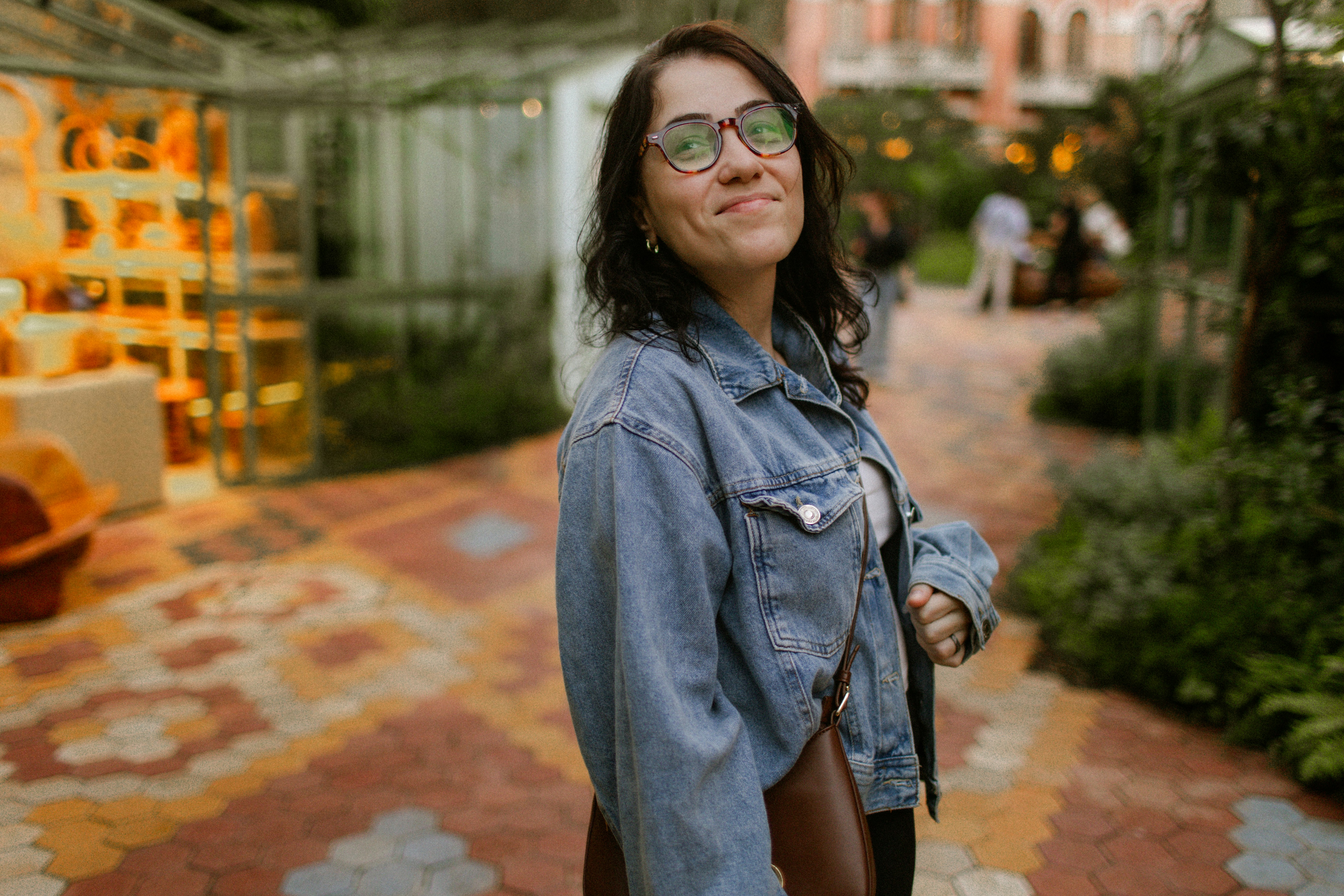 Denim Confidence in a Courtyard Glow