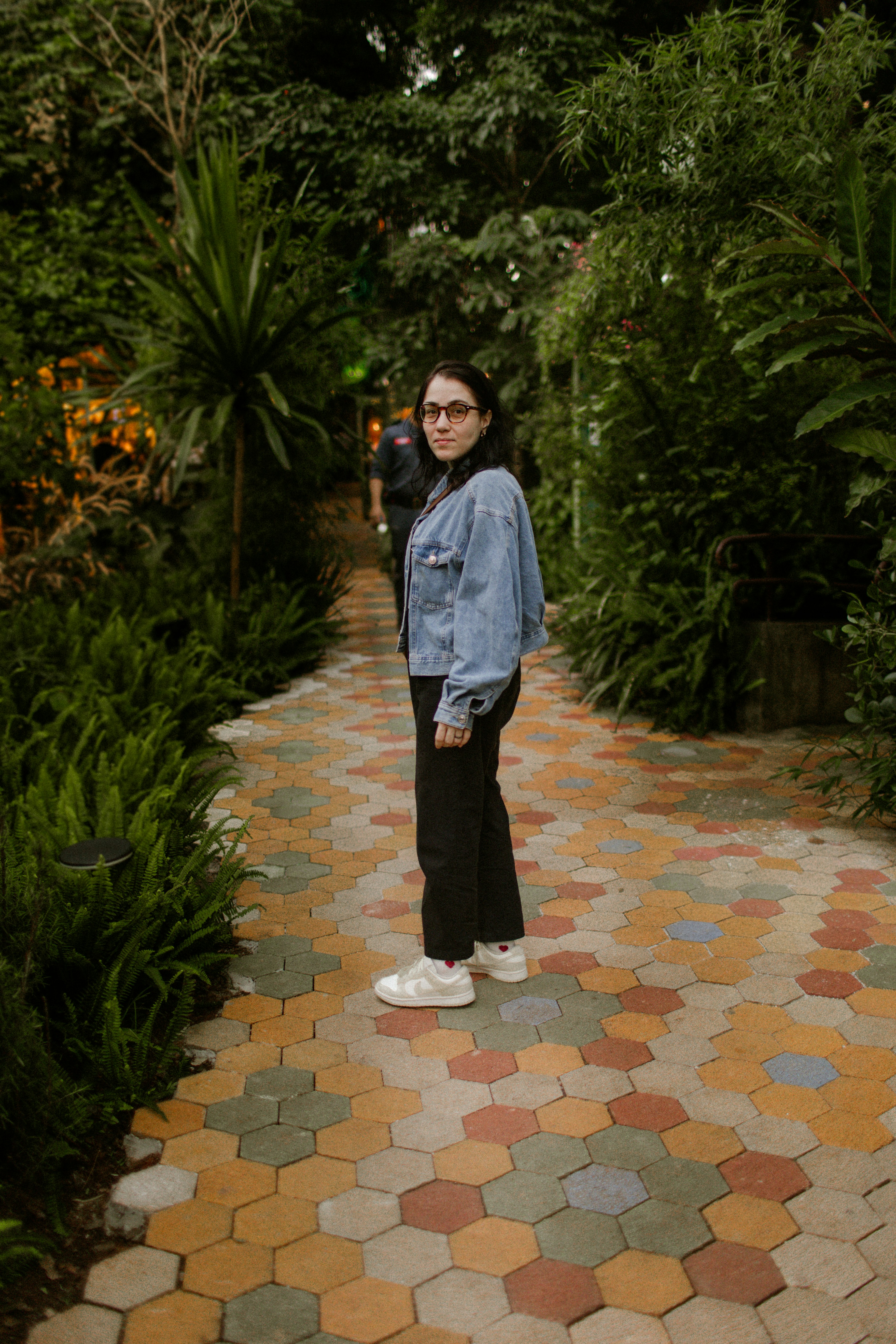 Urban oasis portrait: denim jacket, calm gaze