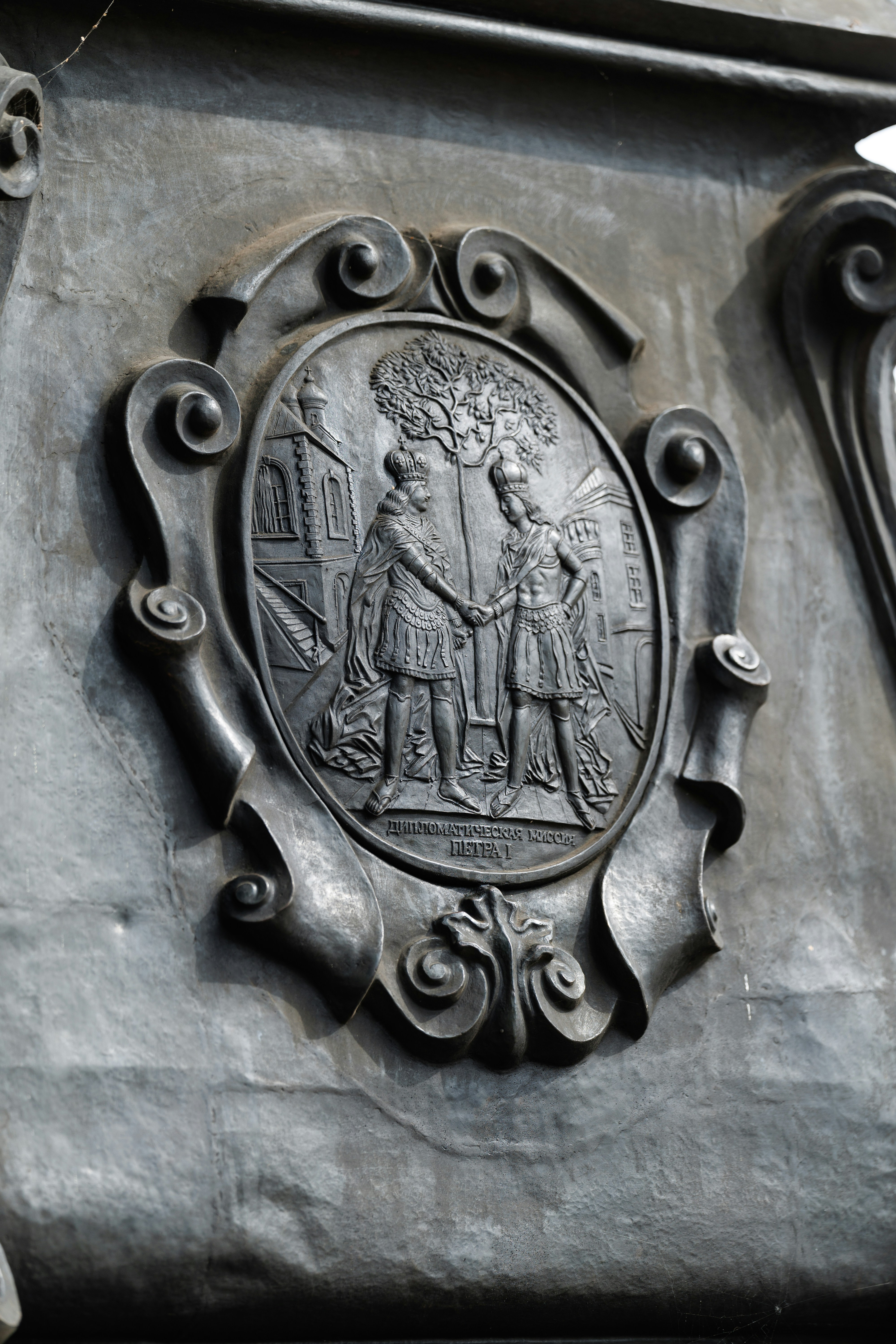 Heraldic Embrace: A Shield Emblem Carved in Stone