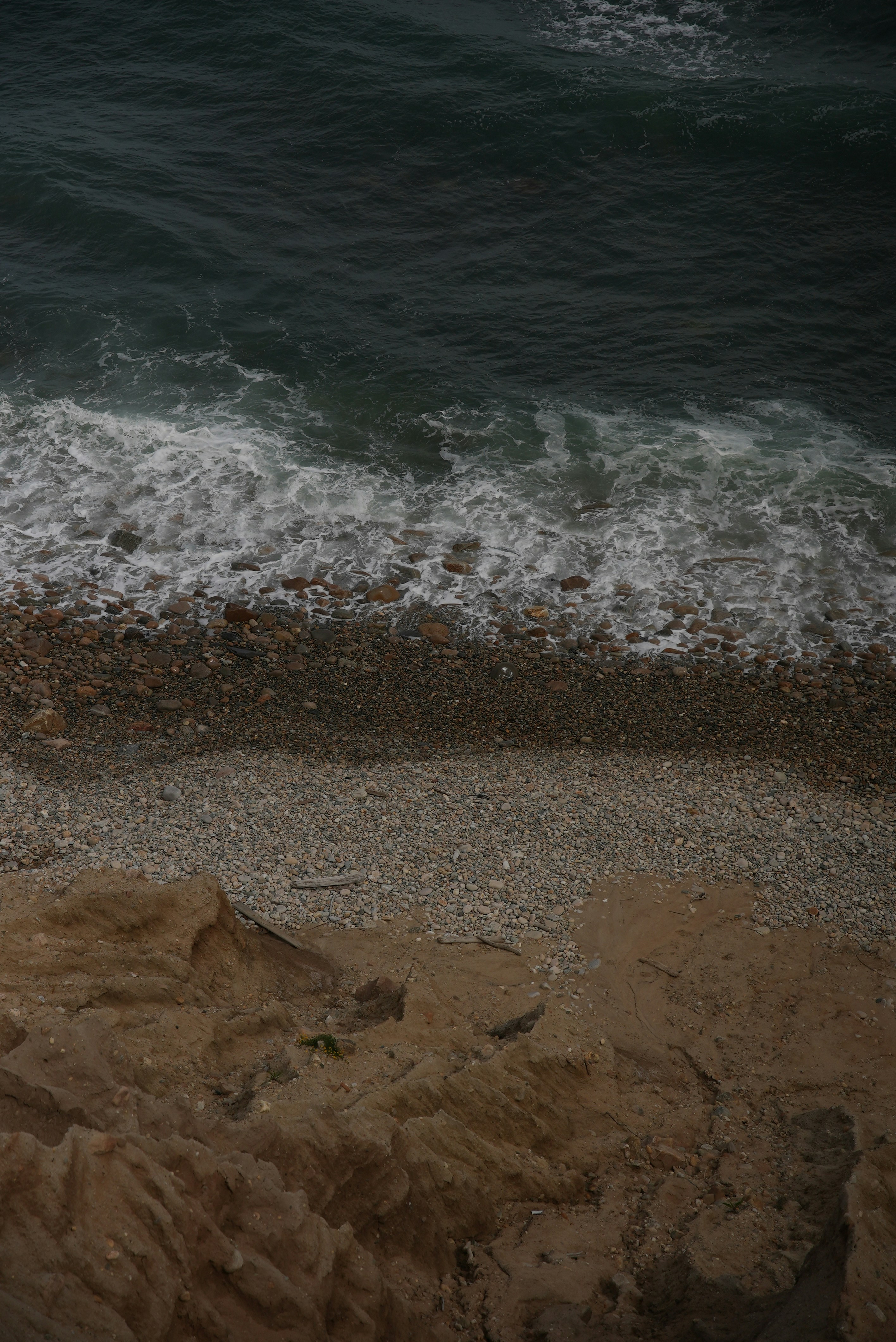 Coastal Footprints: Shoreline Transition from Pebble to Sand