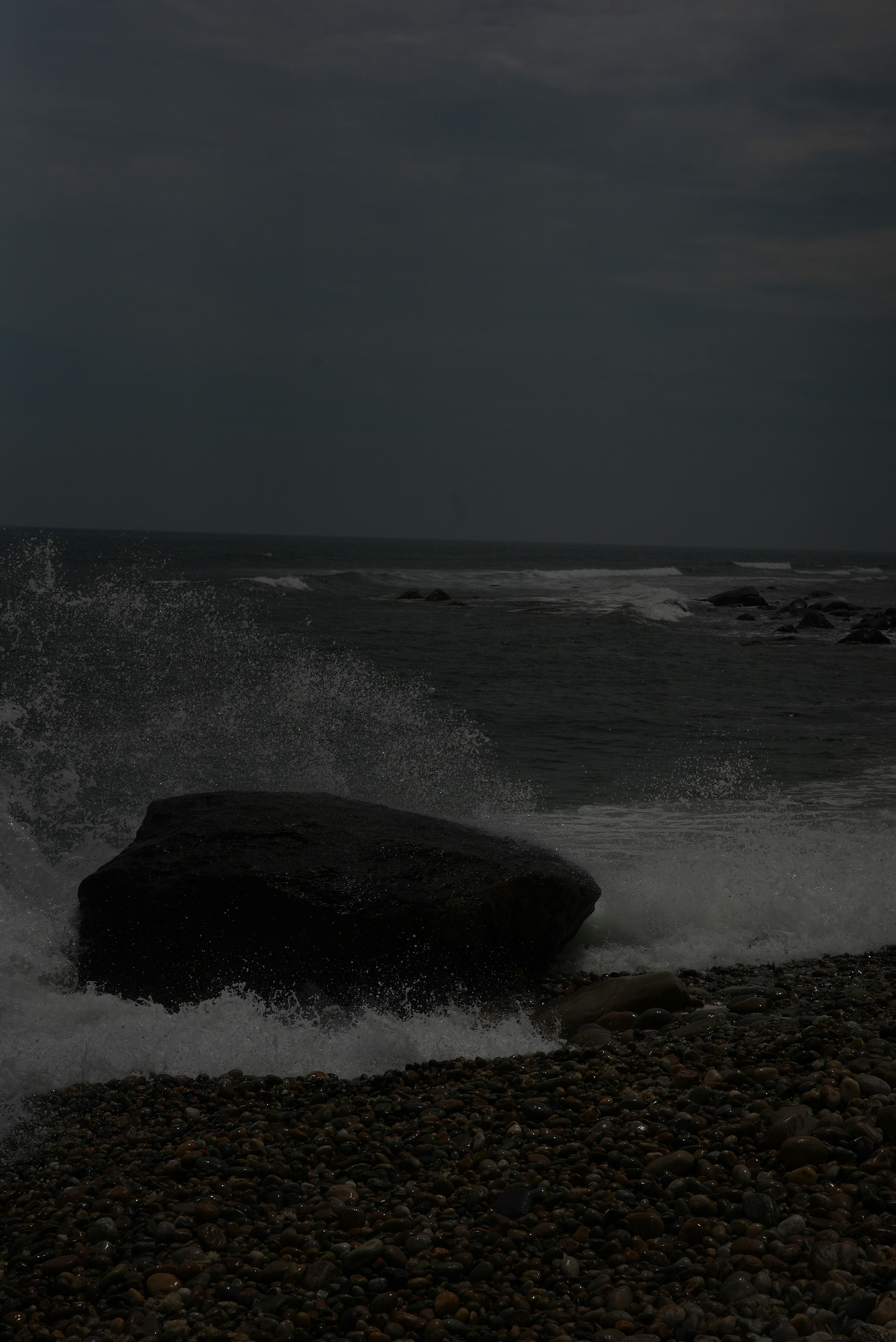 Breaking Foam at Dusk: A Quiet Shoreline in Shadow