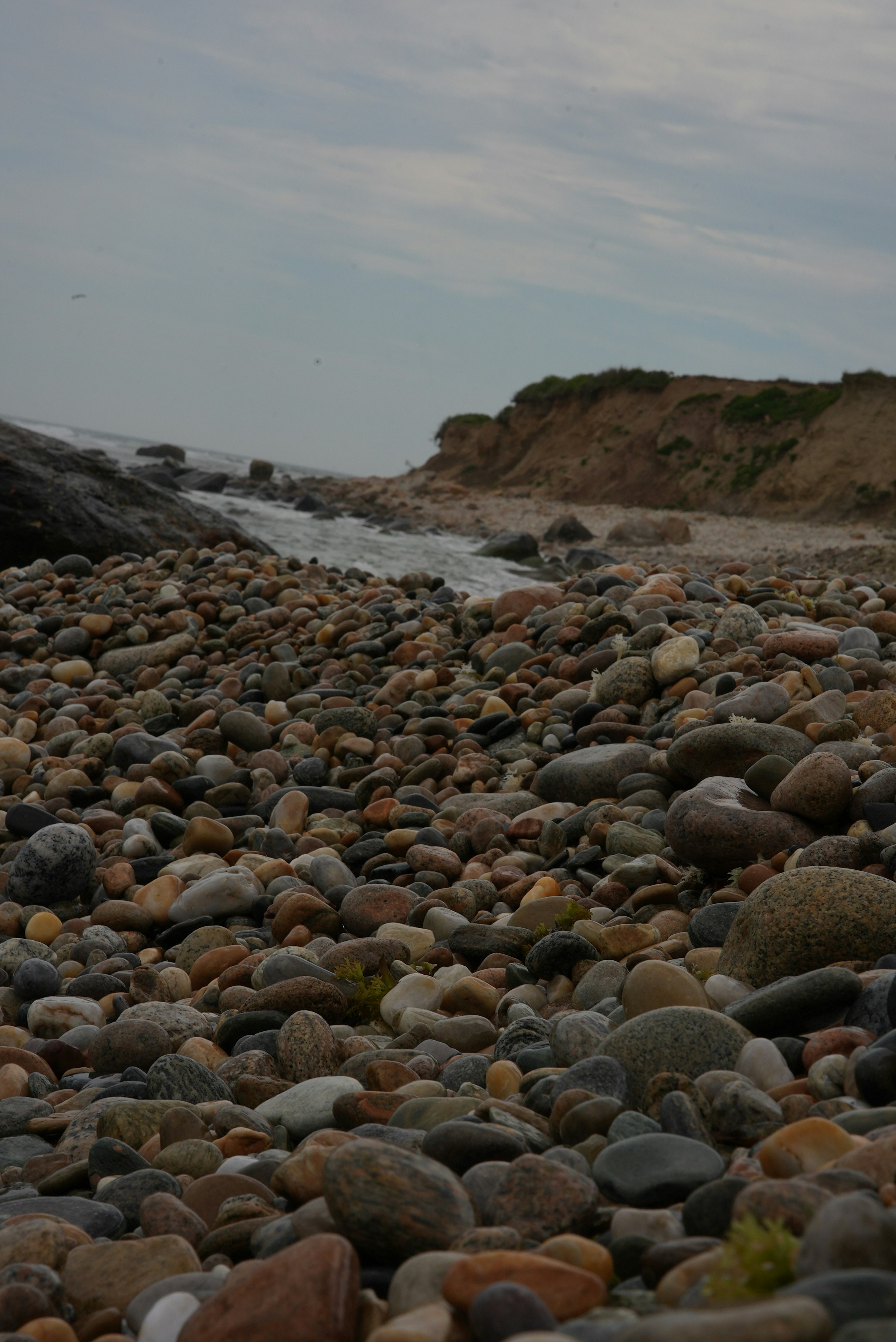 Pebble Sea: A Quiet Shoreline Leading to Cliffed Dunes