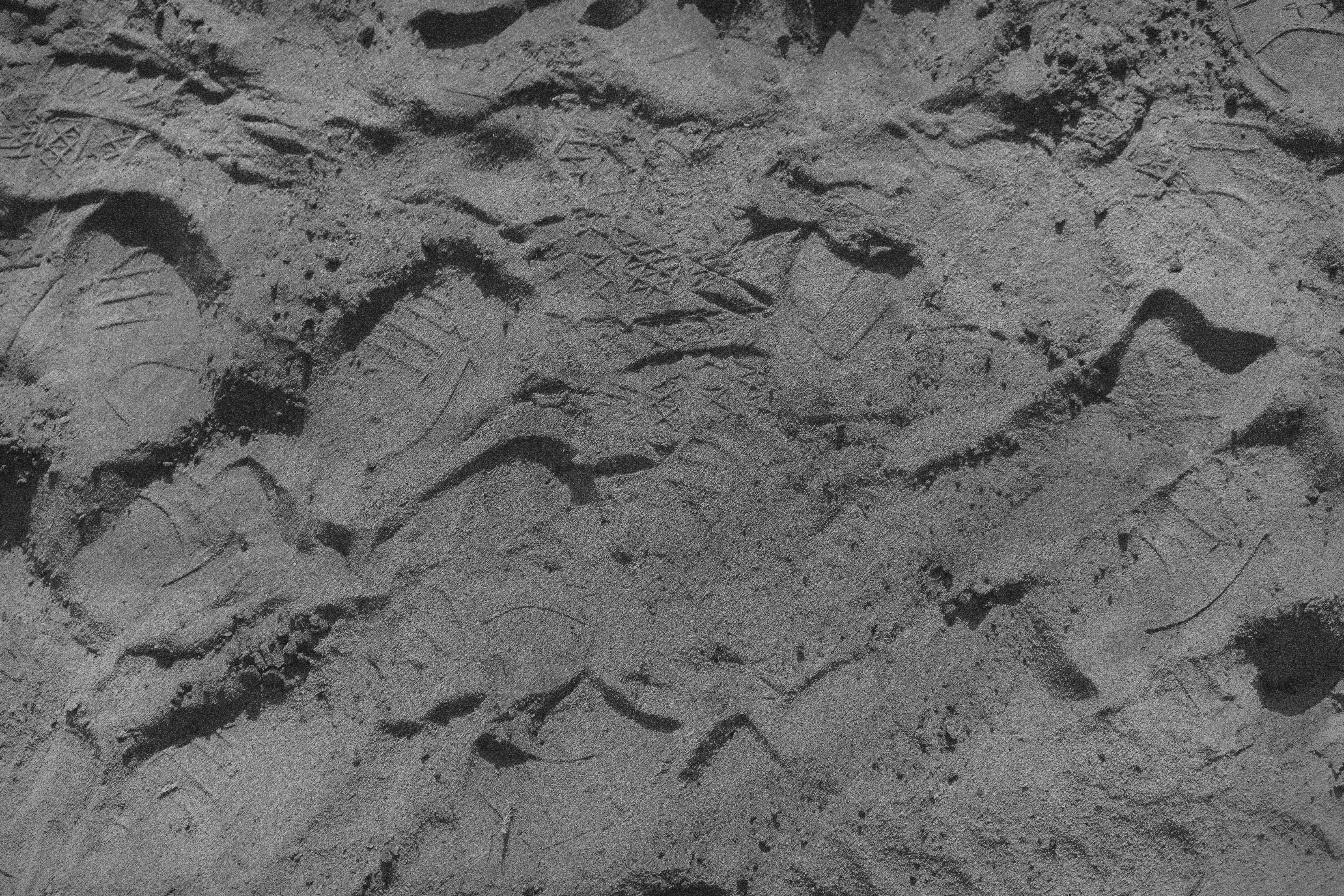 Footpath Echoes: A Quiet Mosaic of Sand Impressions