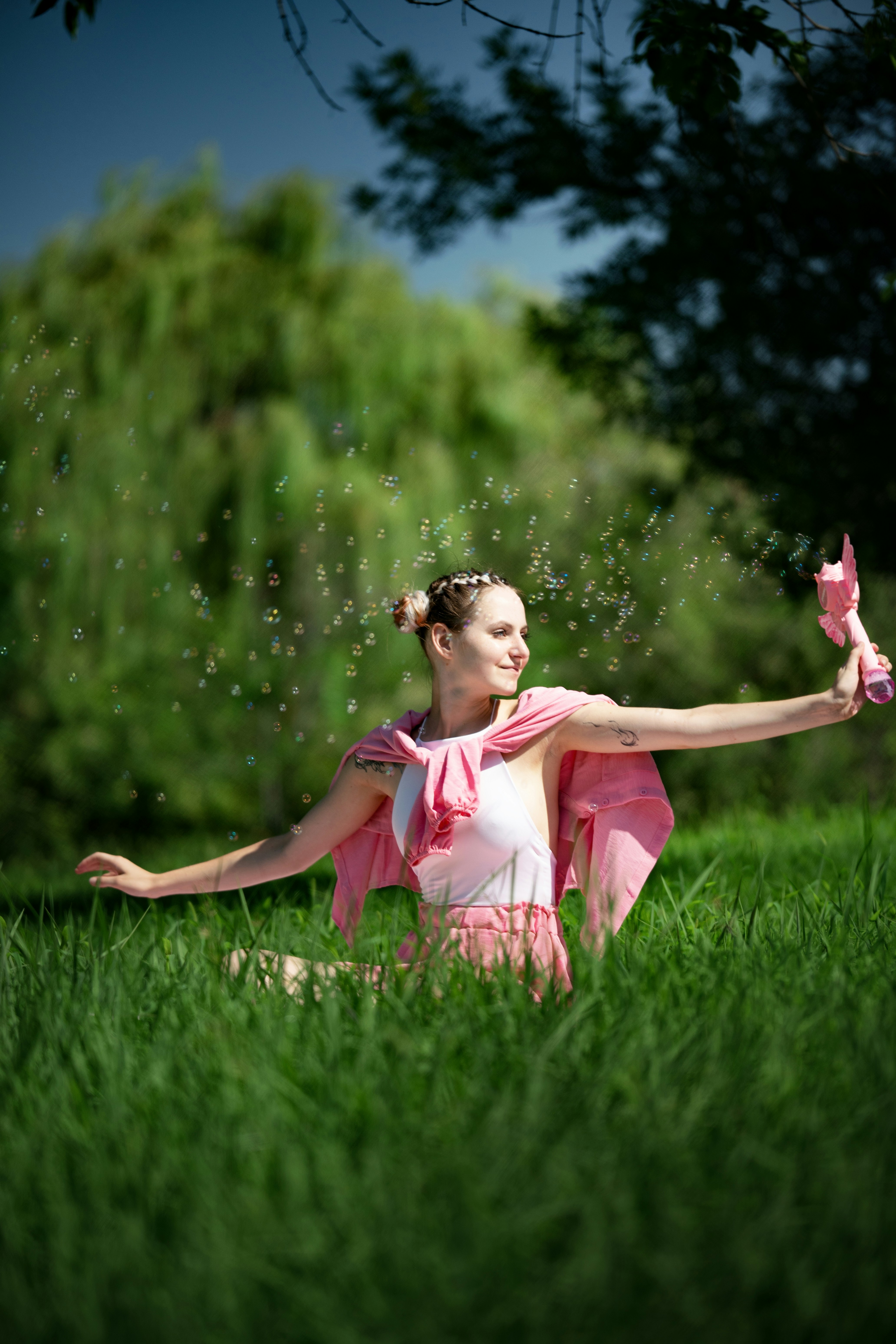 Grace in the Meadow: A Pink Scarf Unfurls on a Sunny Day