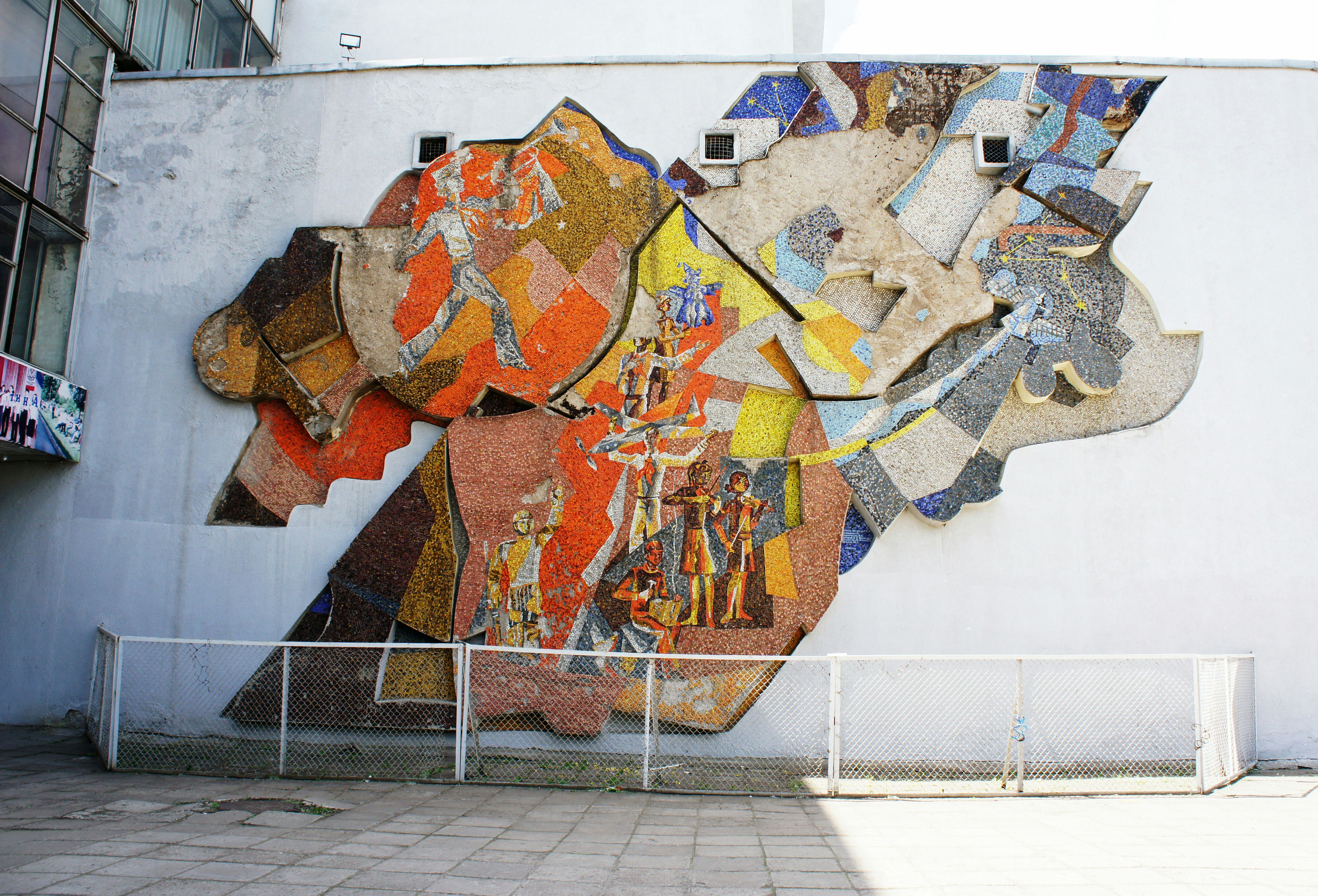 Mosaic Mirage: A Colorful Concrete Tale on White Facade