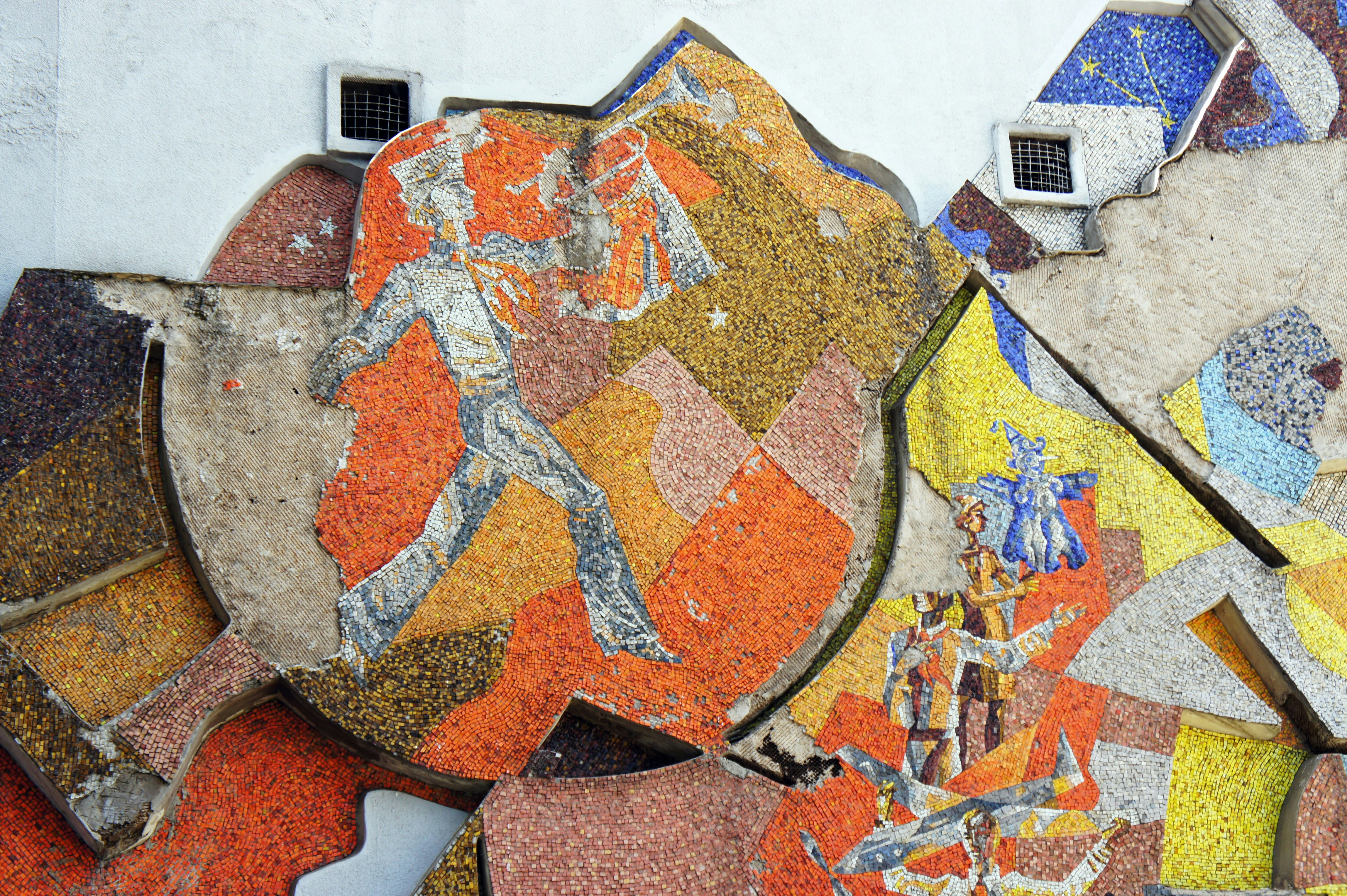 Colorful Fragments: A Ballet of Mosaic Shapes Across a Wall