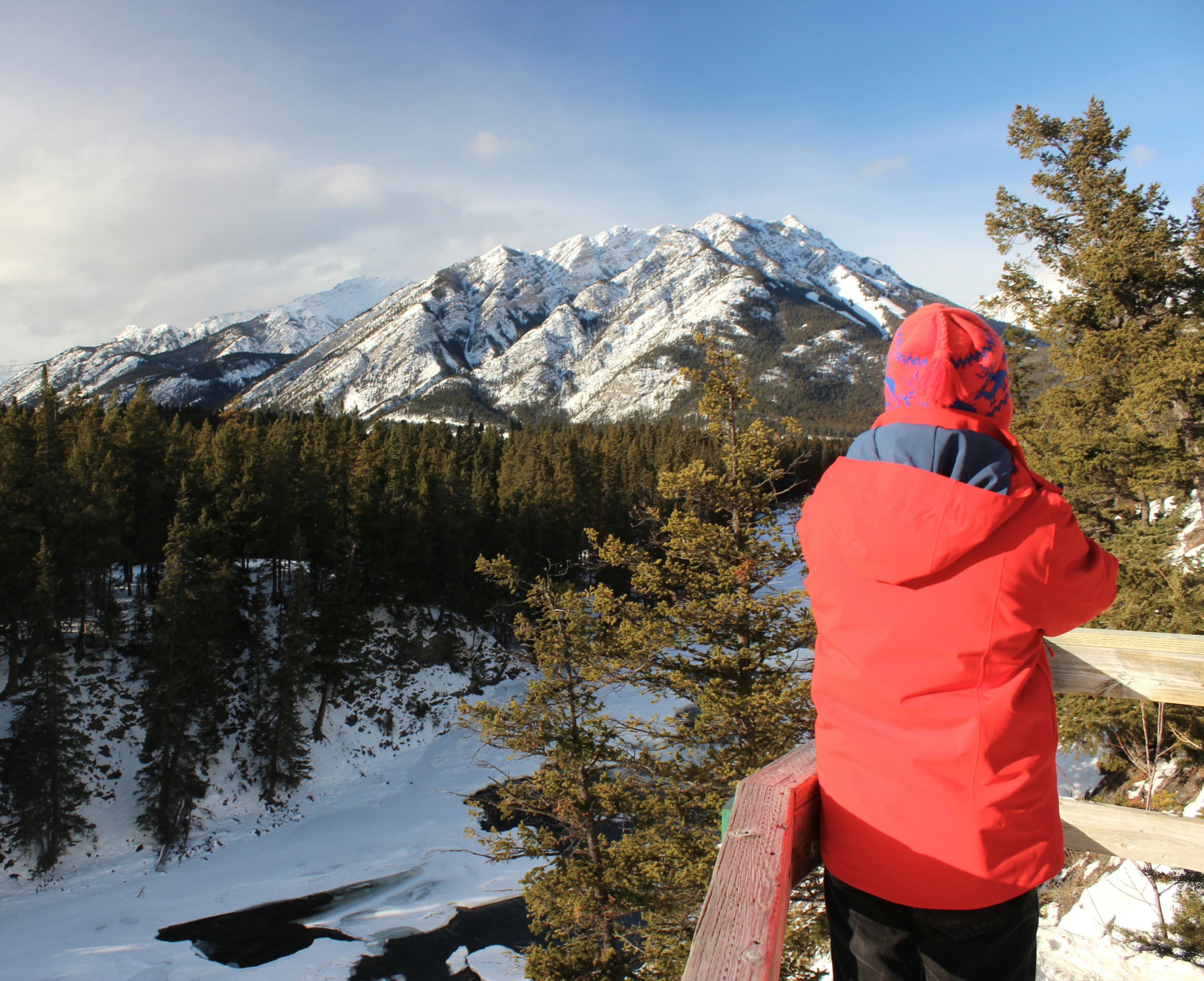 Red Jacket in a Snow-Kissed Alpine Scene