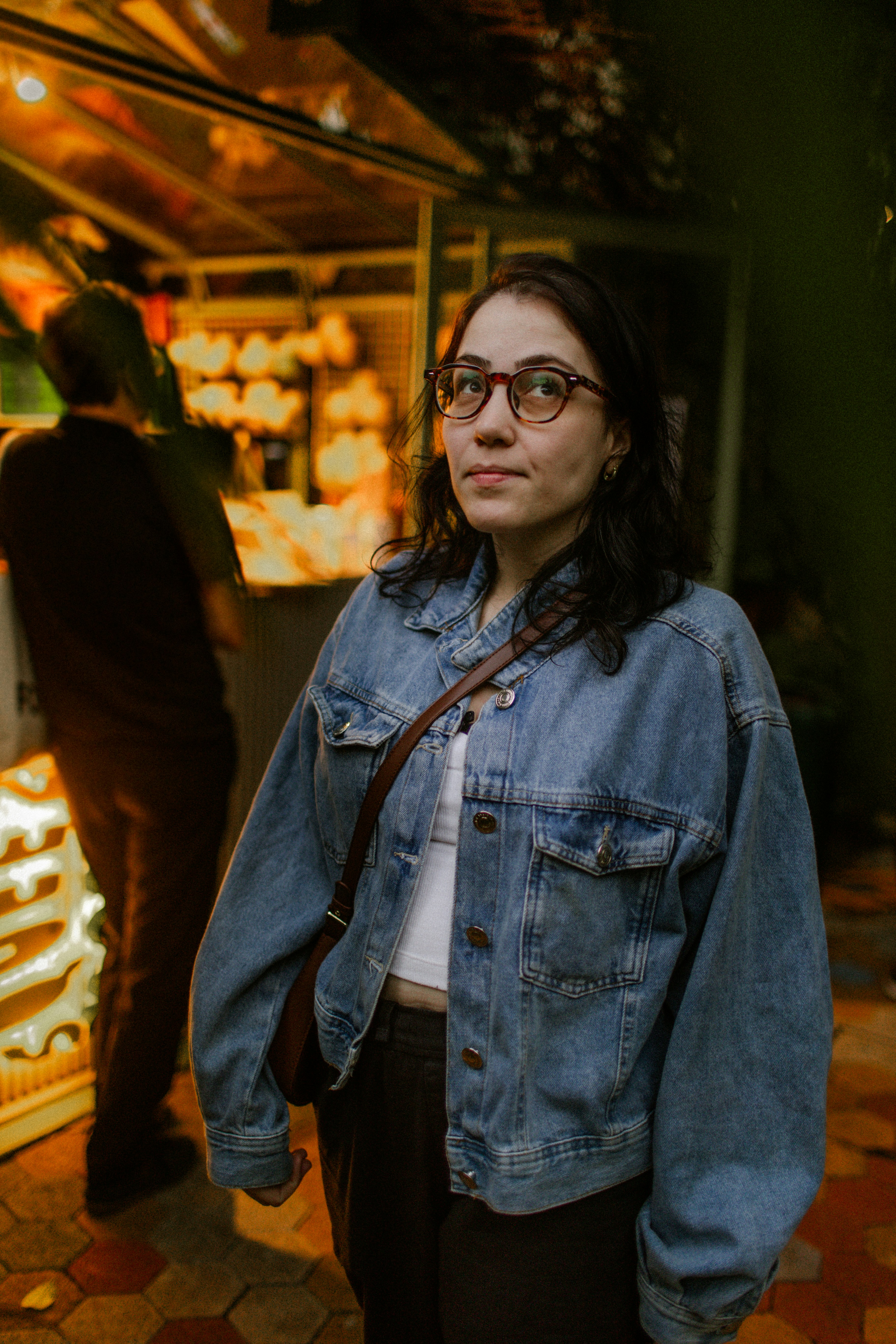 Denim Daylight: A Quiet Portrait at the Market Stall