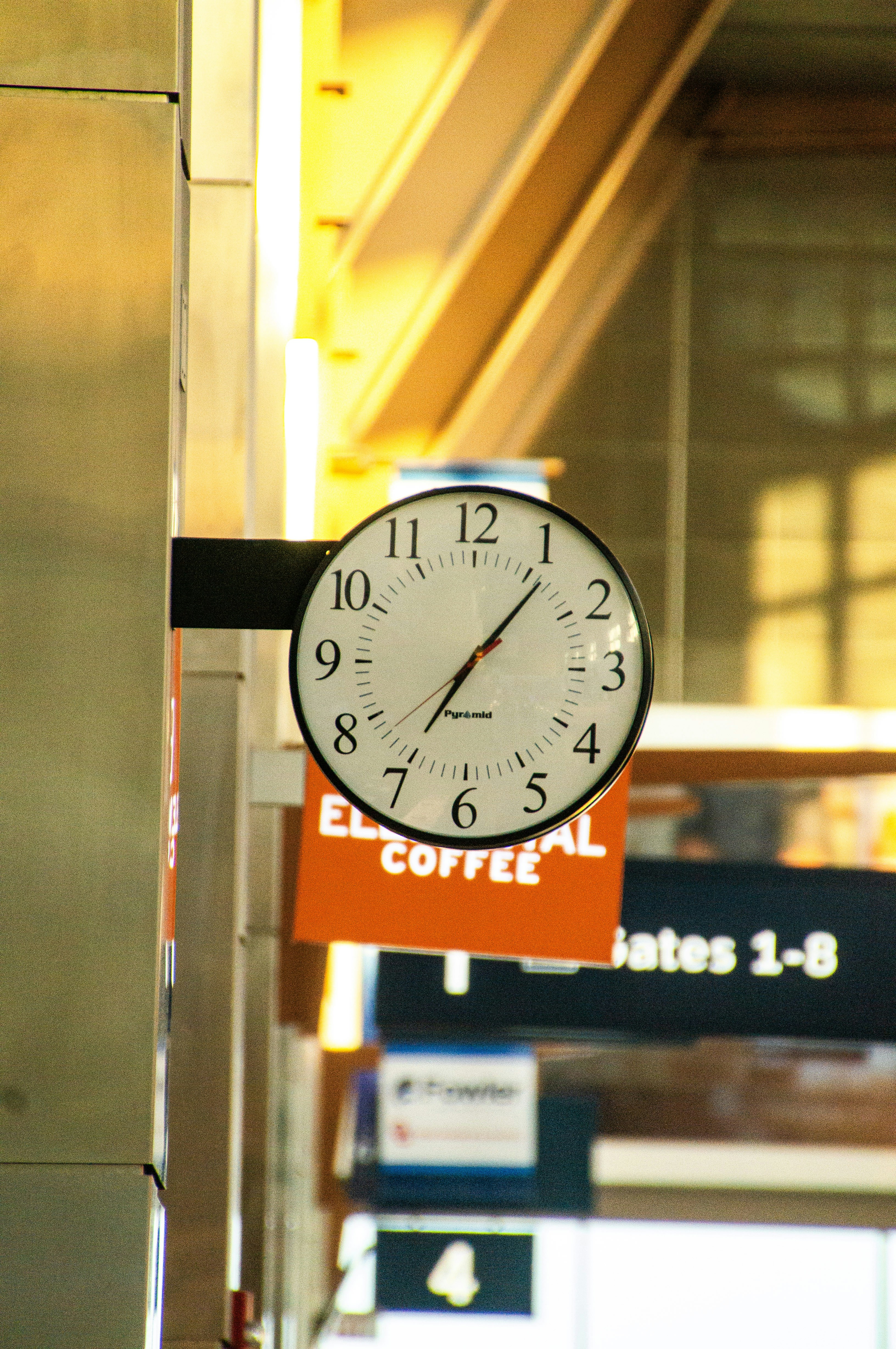 Timekeeper at the Atrium: A Sharp Moment Beneath Neon Light