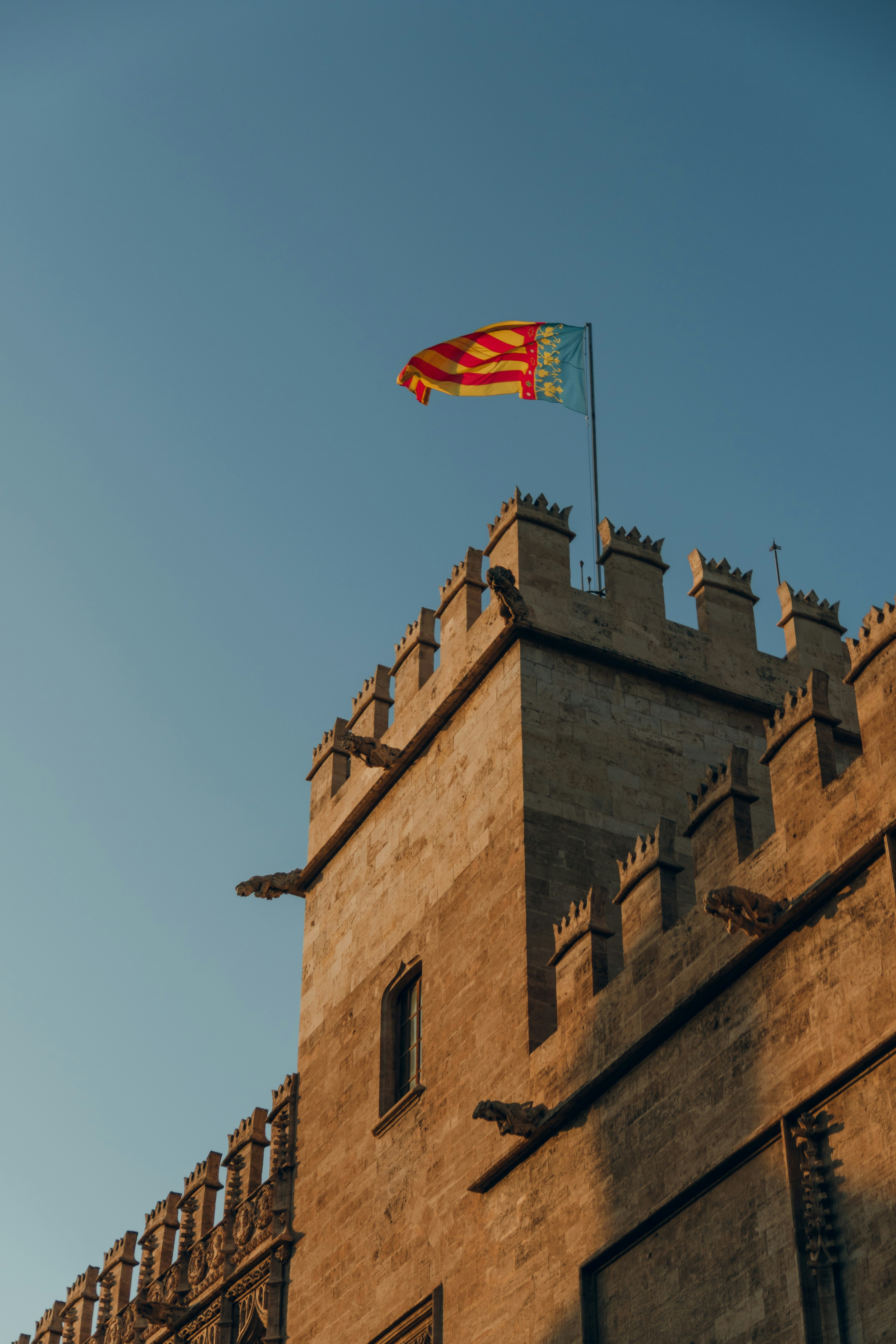 Castle Flag at Dusk: A Castle Top Silhouette with Flag Alight