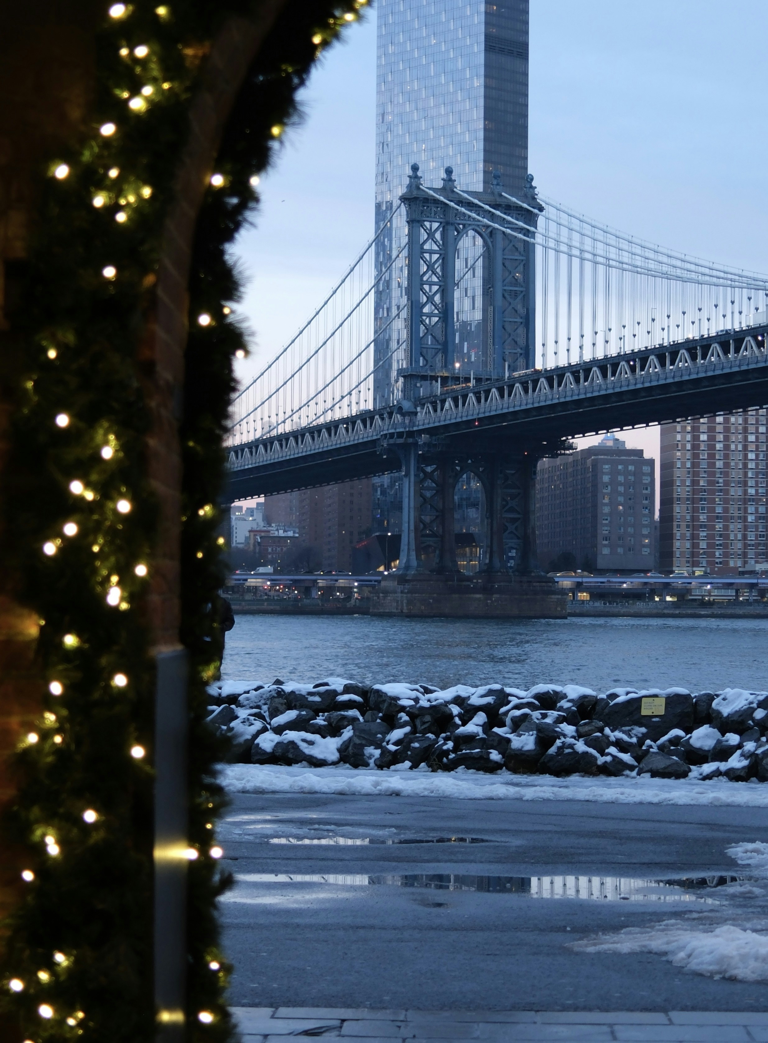 Blue Hour Overlook: Manhattan Bridge Framed by Holiday Glow